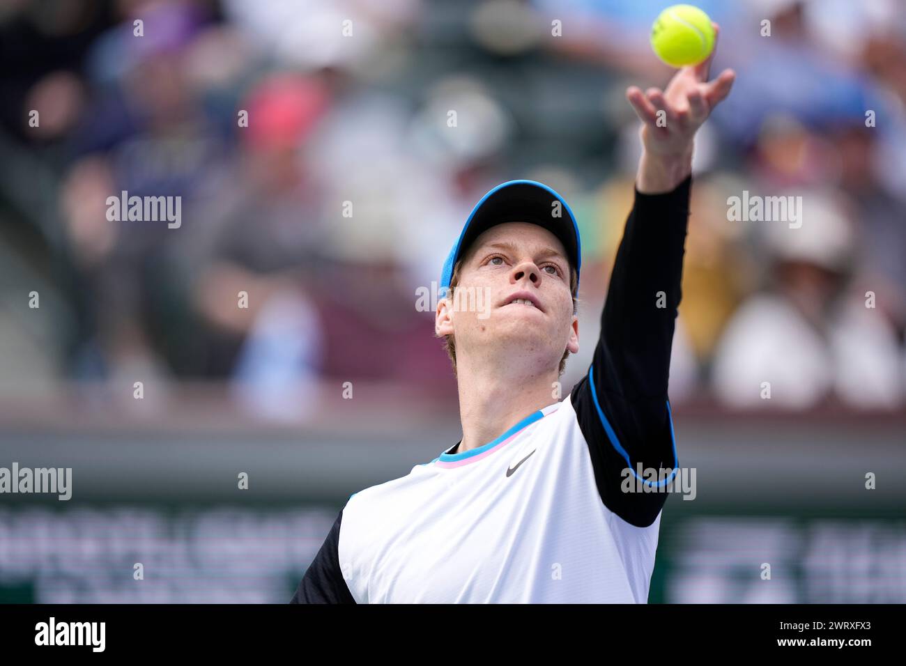 Jannik Sinner, of Italy, serves to Jiri Lehecka, of the Czech Republic ...