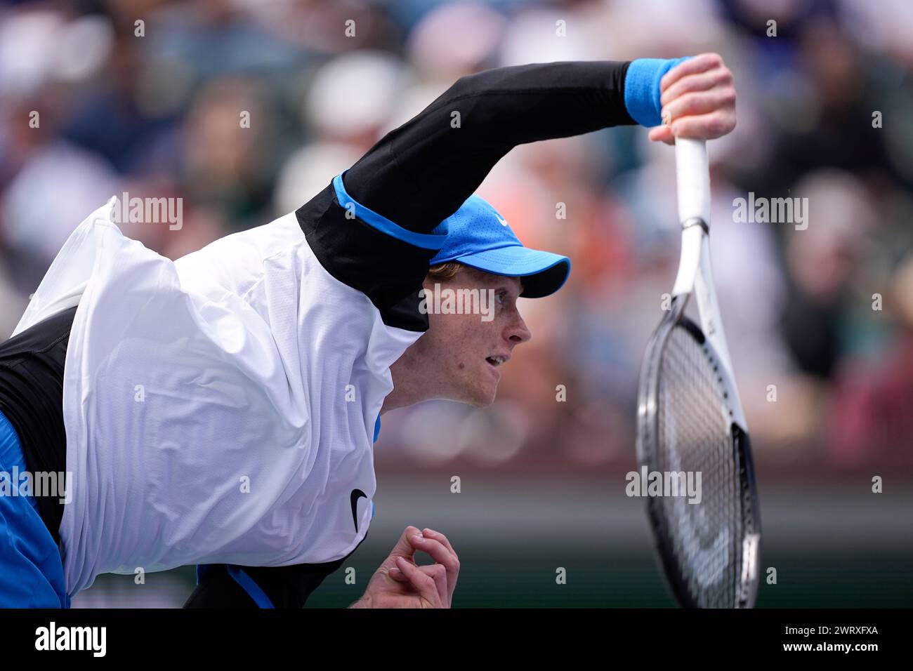 Jannik Sinner, of Italy, serves to Jiri Lehecka, of the Czech Republic ...