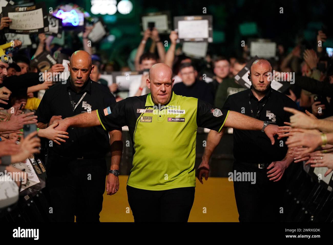 Michael van Gerwen walks out to play Luke Littler (not pictured) on ...