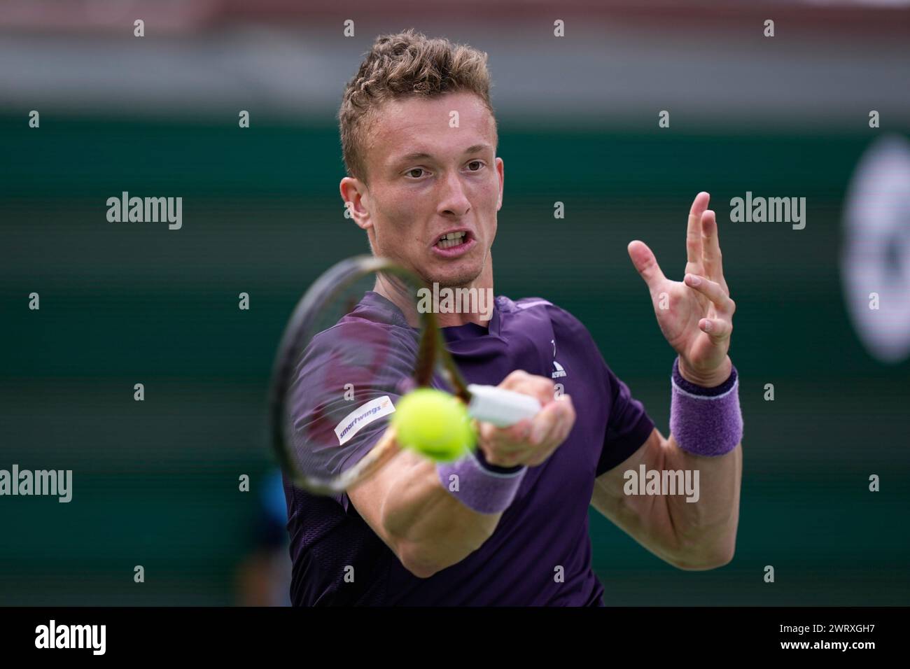 Jiri Lehecka, of the Czech Republic, returns to Jannik Sinner, of Italy ...