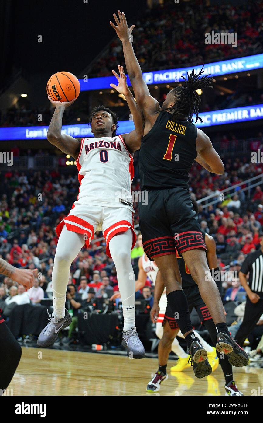 LAS VEGAS, NV - MARCH 14: Arizona Wildcats guard Jaden Bradley (0) shoots over USC Trojans guard ...