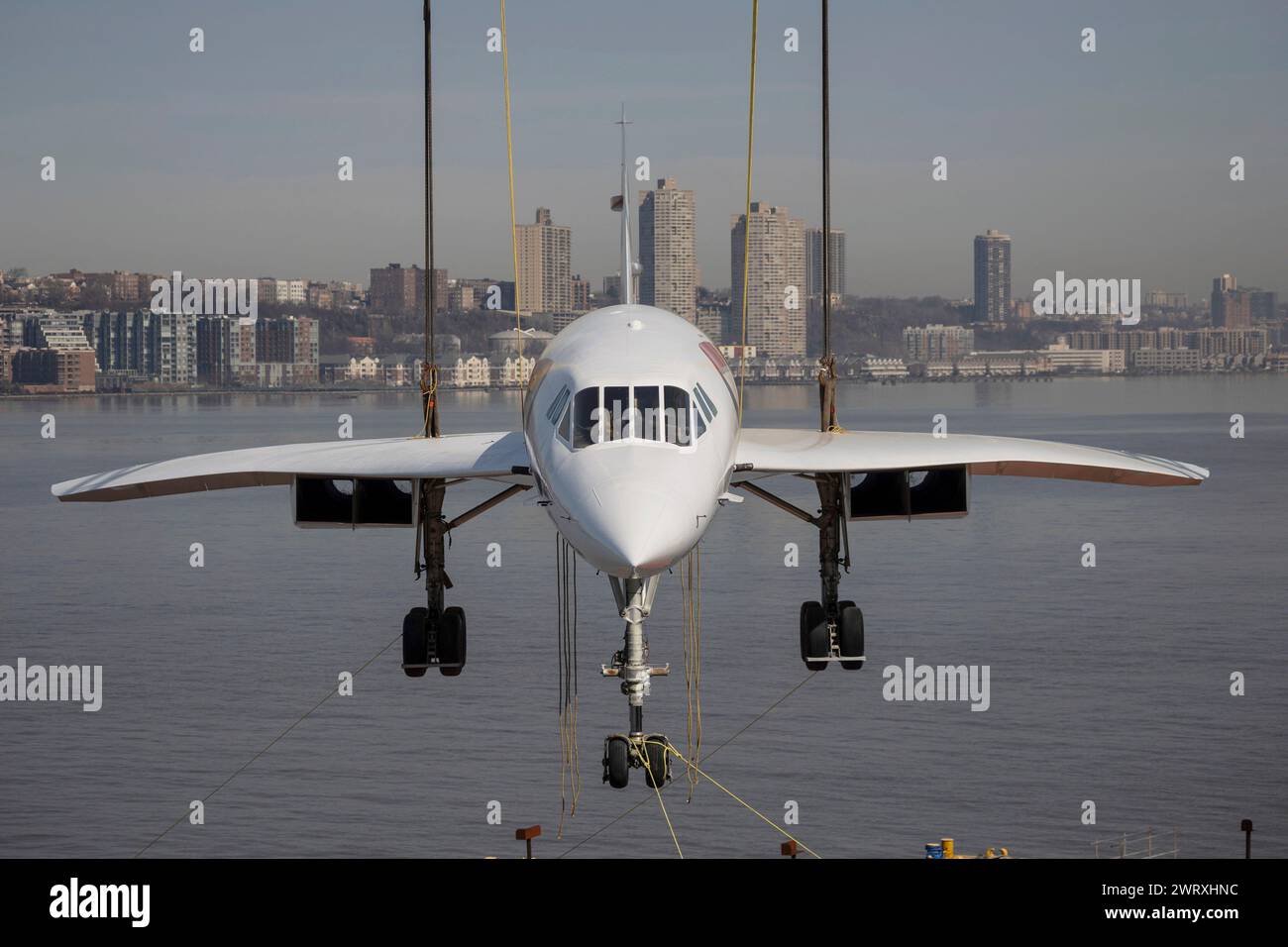 A retired British Airways Concorde supersonic aircraft is lifted by a ...