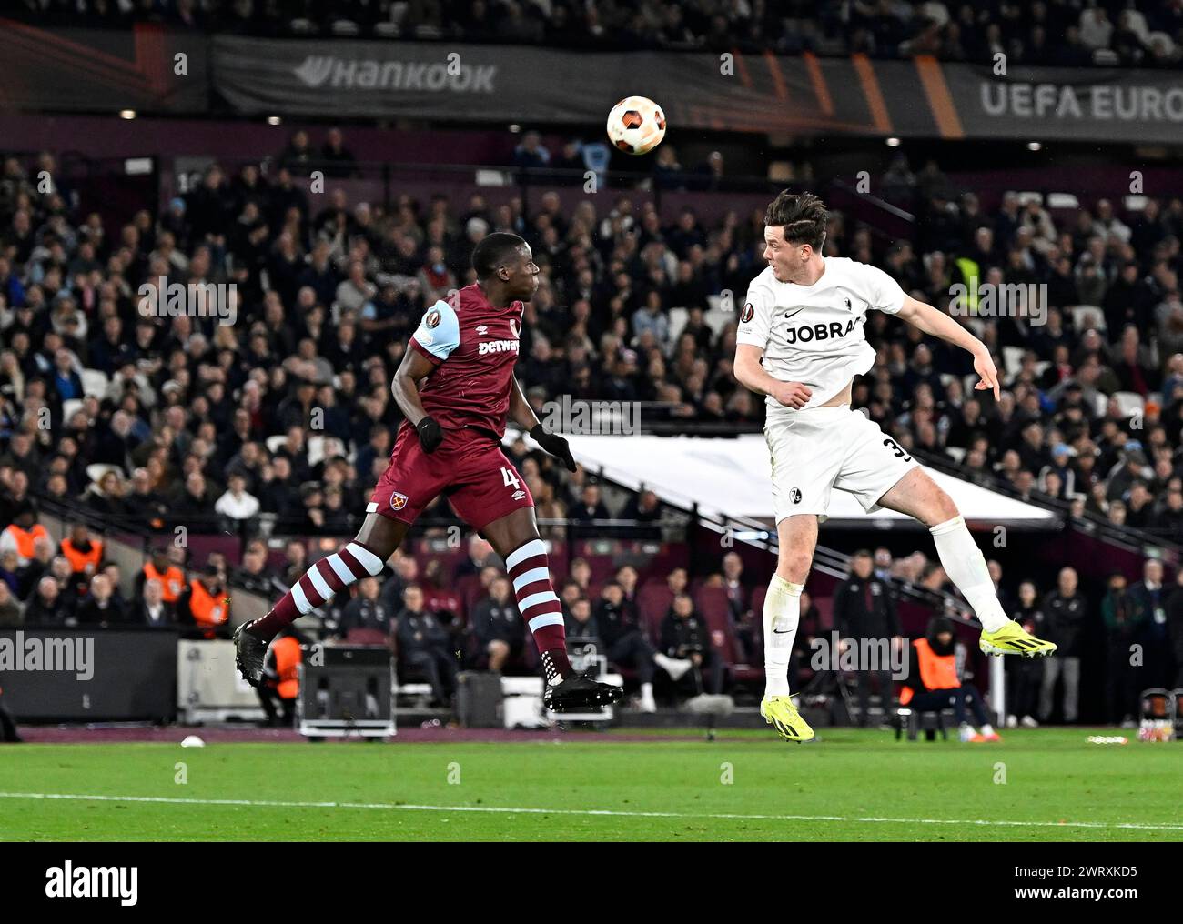 London, UK. 14th Mar, 2024. Kurt Zouma (West Ham) and Michael ...