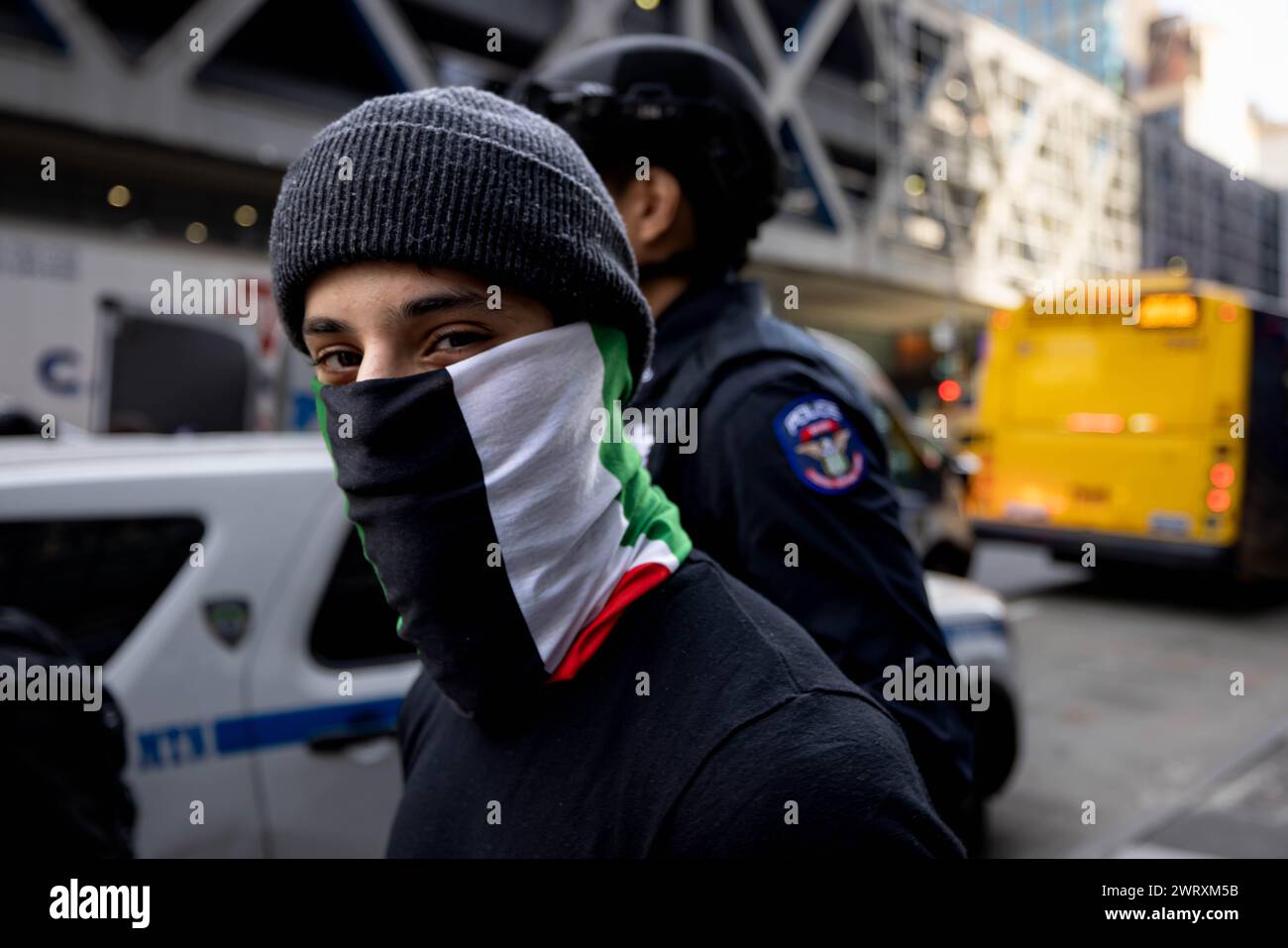 NEW YORK, NEW YORK - MARCH 14: Police escort handcuffed pro-Palestine ...