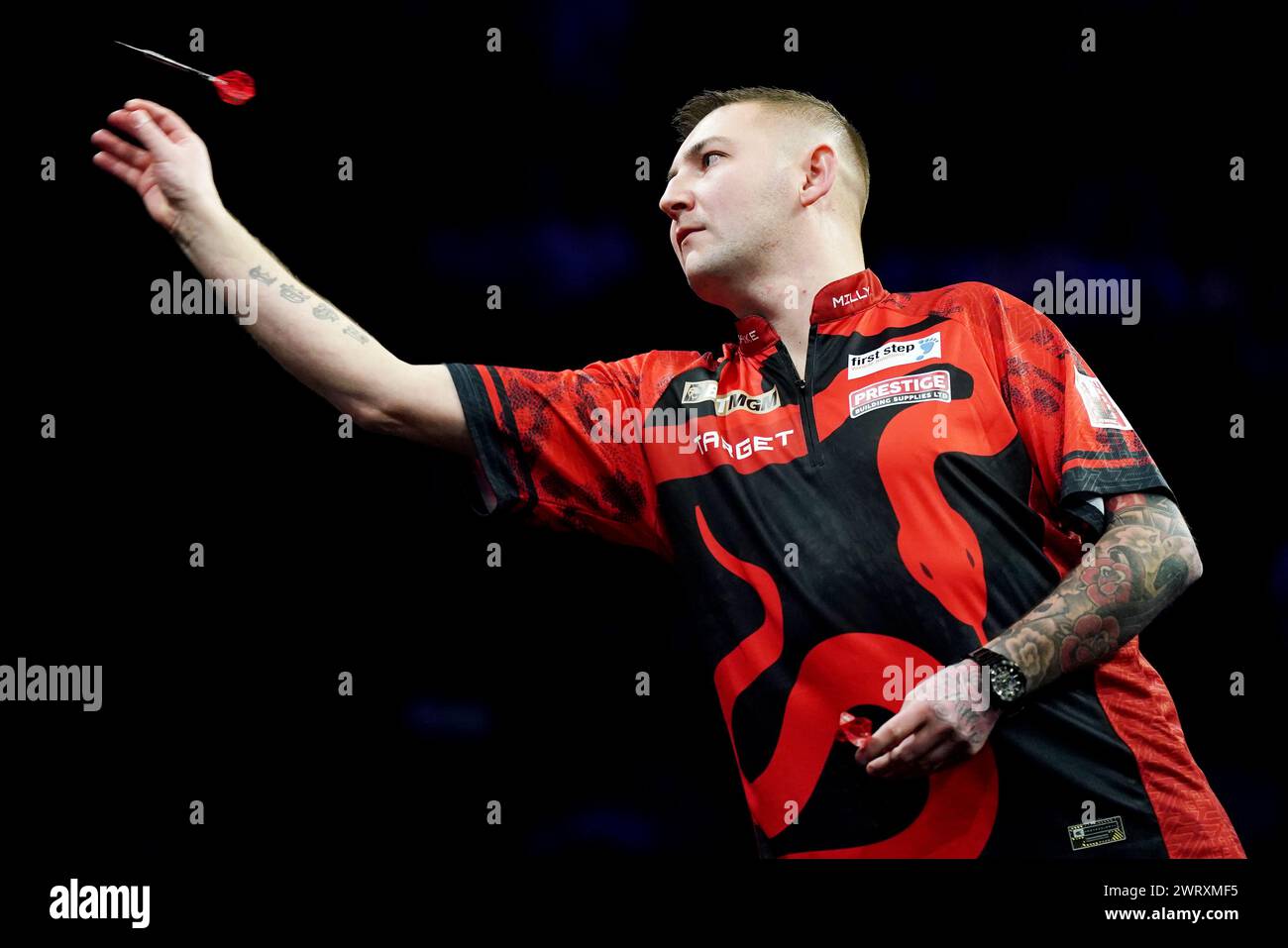Nathan Aspinall in action against Rob Cross (not pictured) on night ...