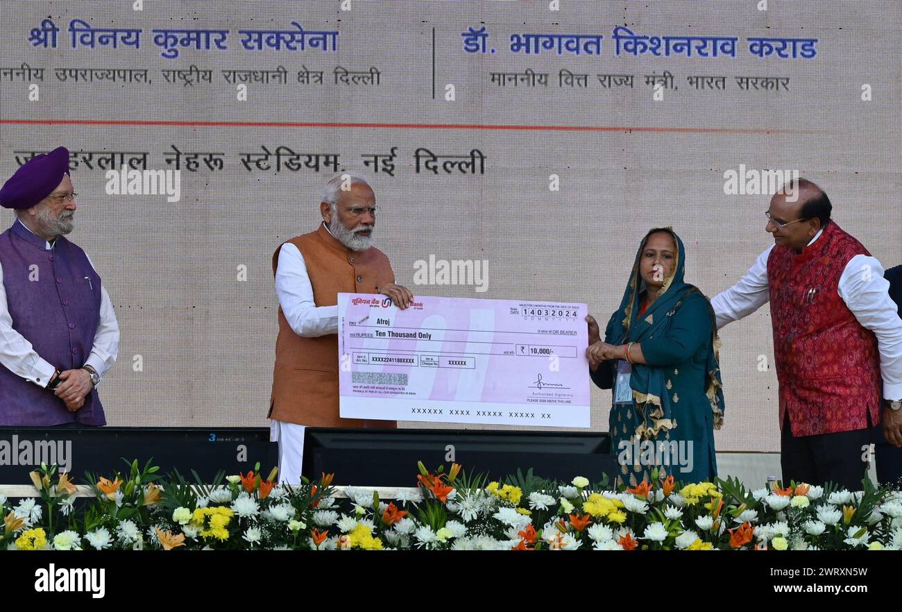 NEW DELHI, INDIA - MARCH 14: Prime Minister Narendra Modi presents a ...