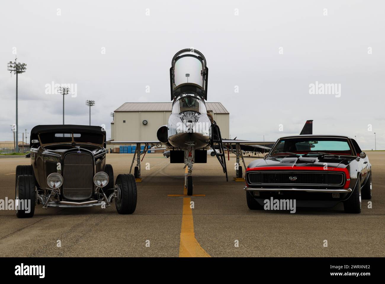 Vehicles posed on the flight line with a T-38 Talon at Beale Air Force ...