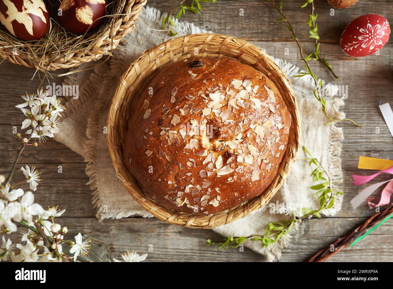 Traditional Czech sweet Easter pastry called mazanec, with eggs dyed ...