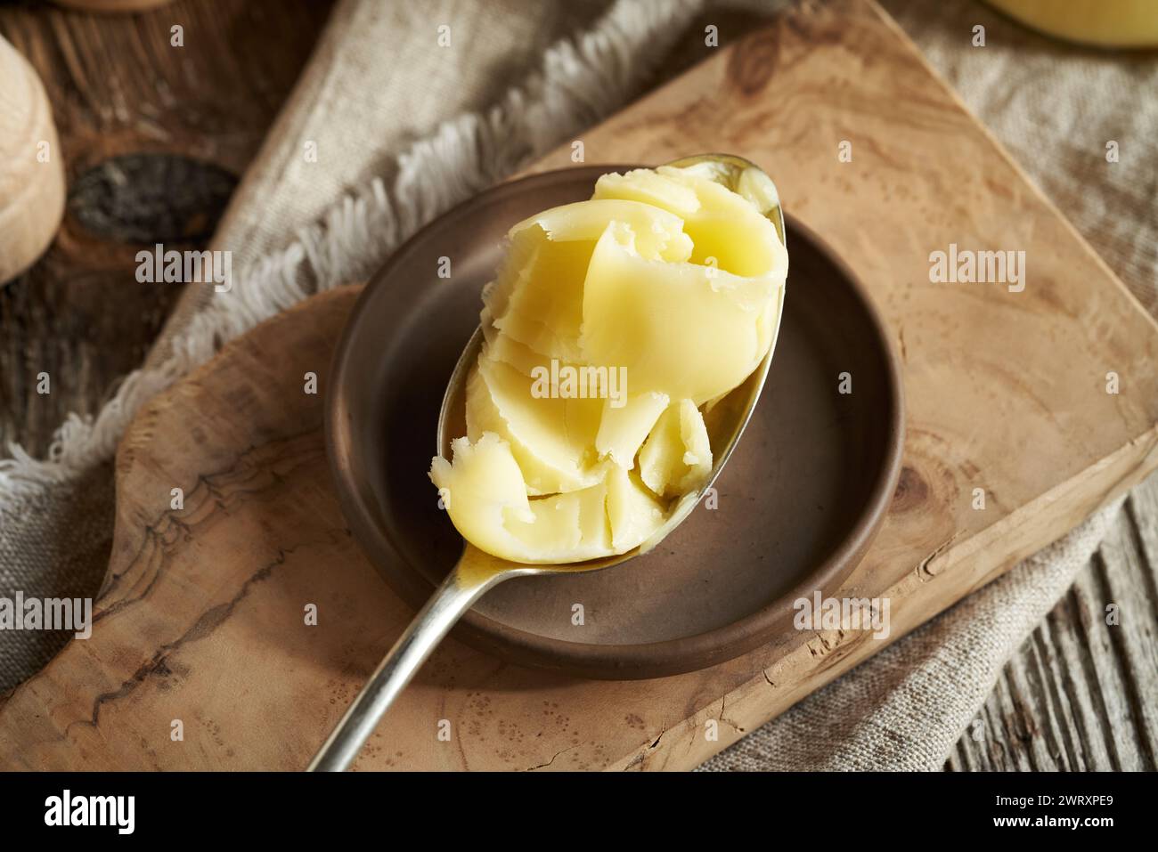 A spoonful of ghee or clarified butter, close up Stock Photo - Alamy