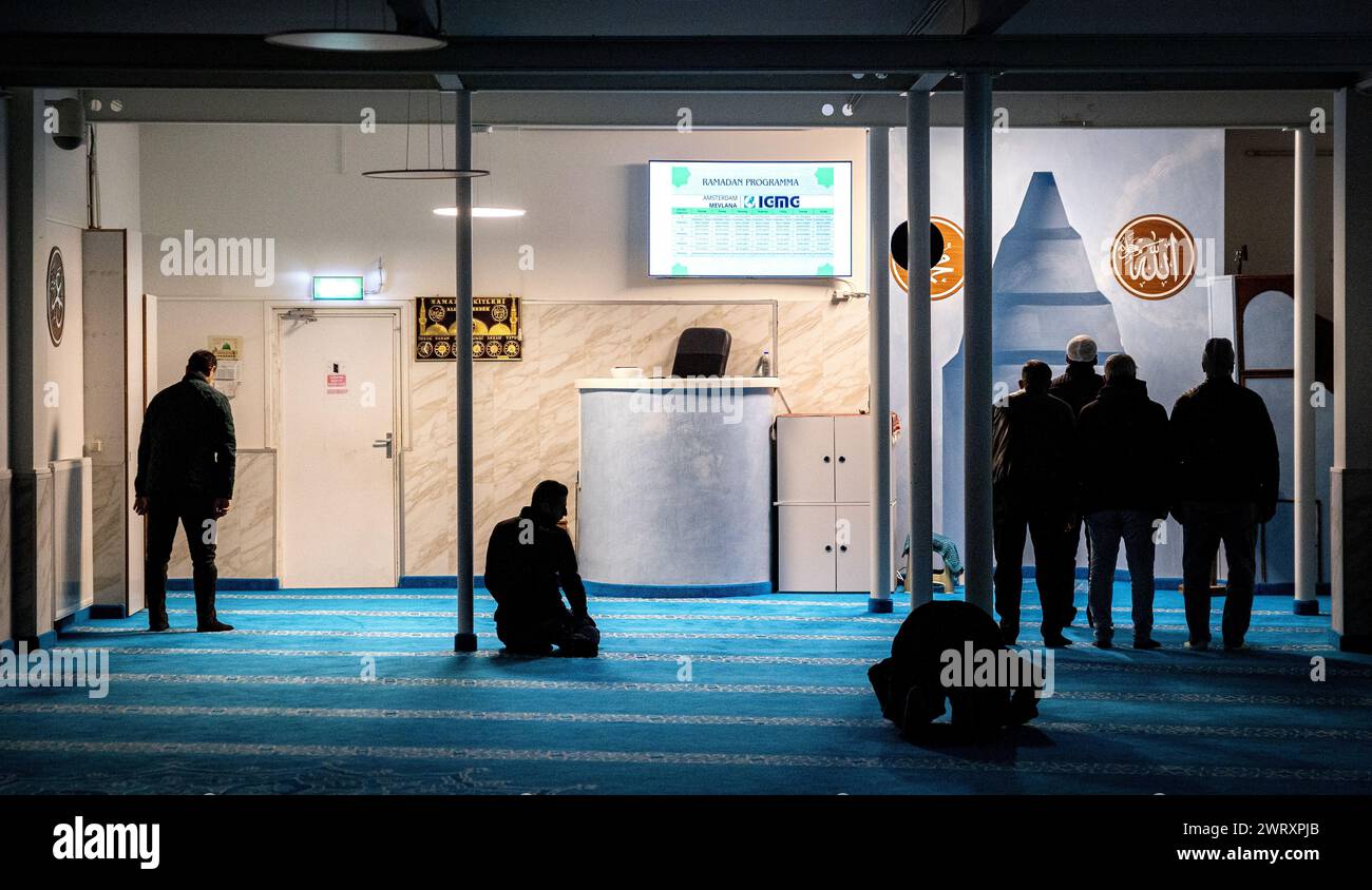 AMSTERDAM - A prayer during Ramadan at the Mevlana Mosque. ANP RAMON ...
