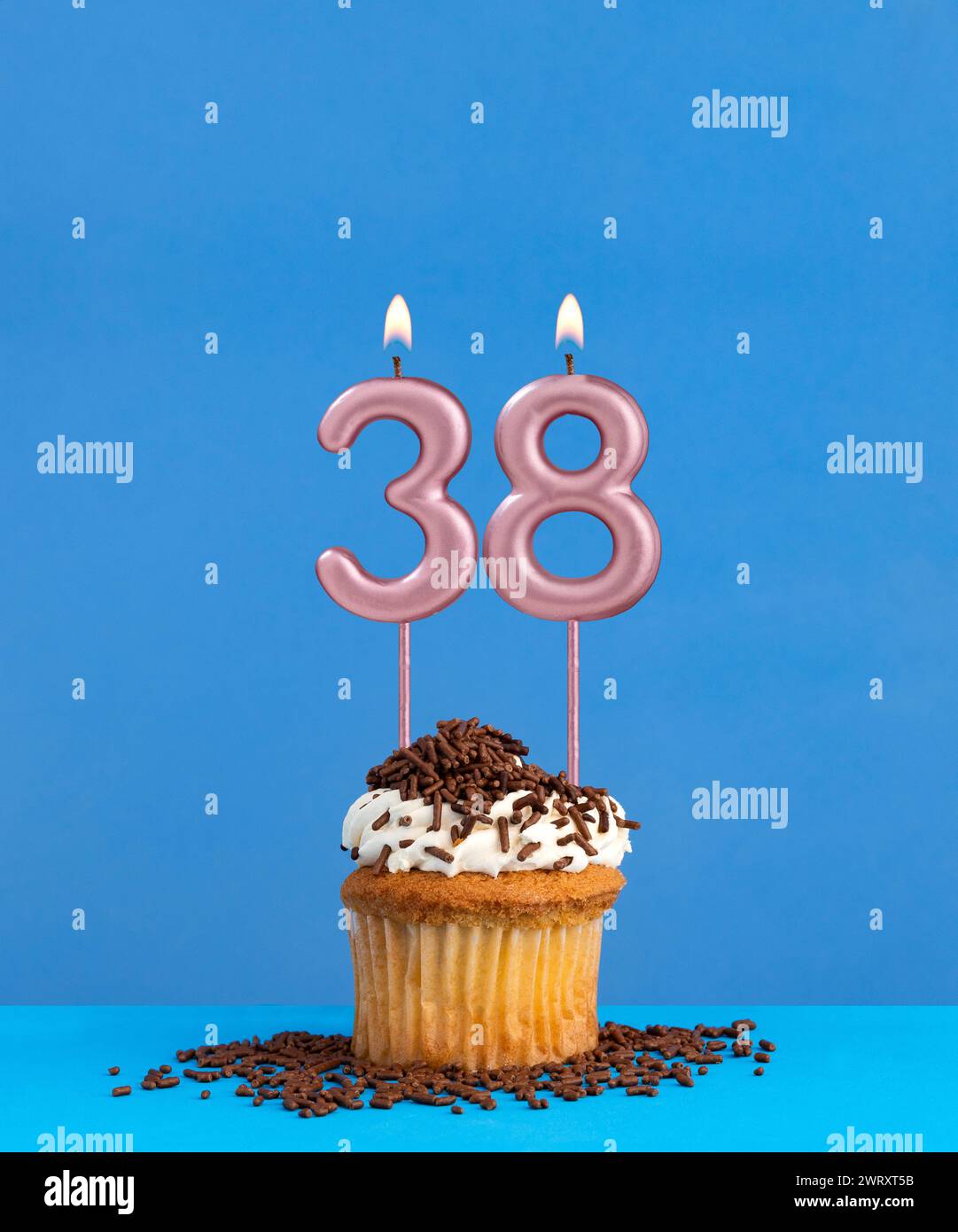 Candle number 38 - Birthday card with cupcake on blue background Stock ...