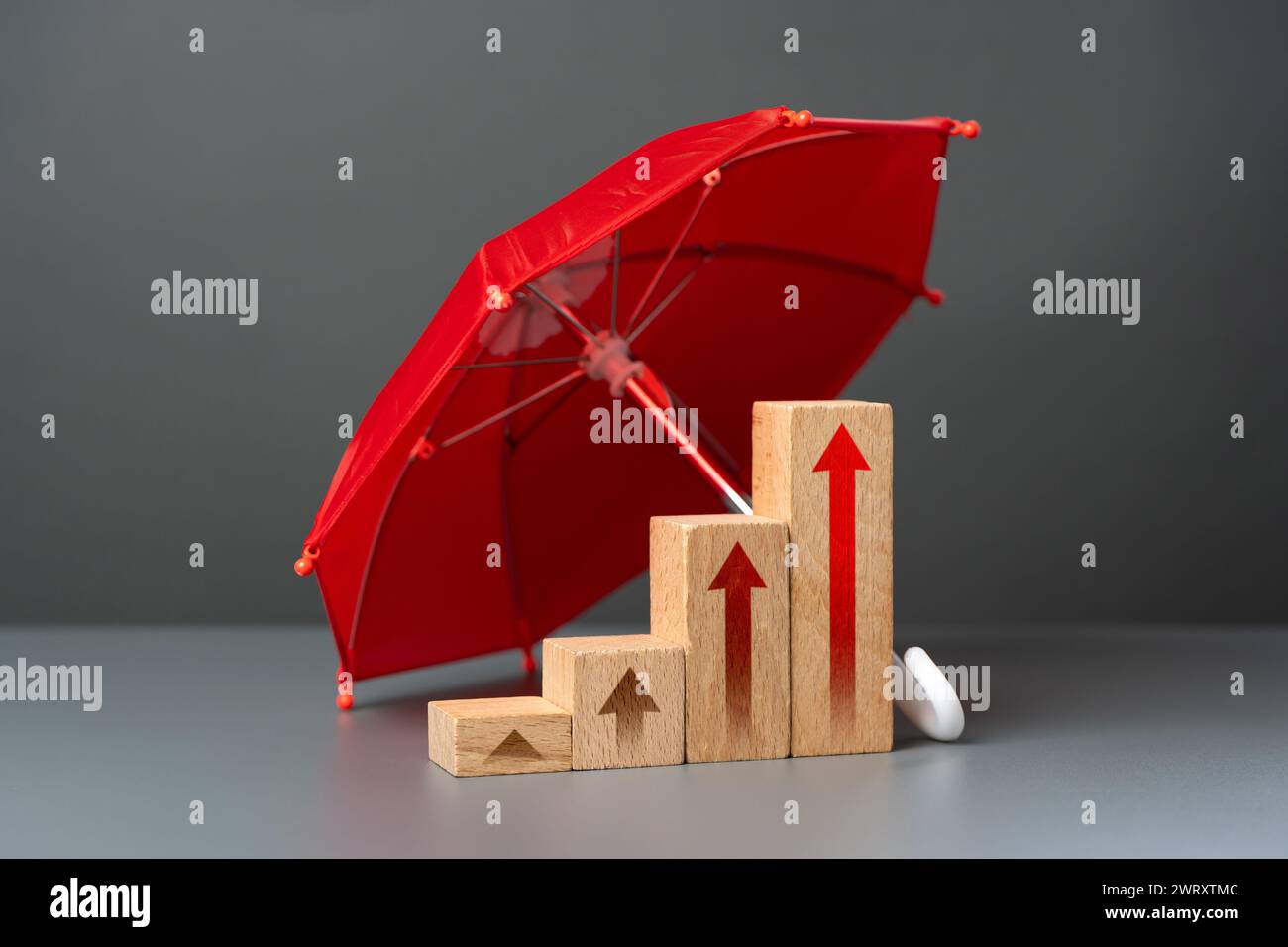 Business growth and insurance. Growing graph under umbrella. Growth and ...