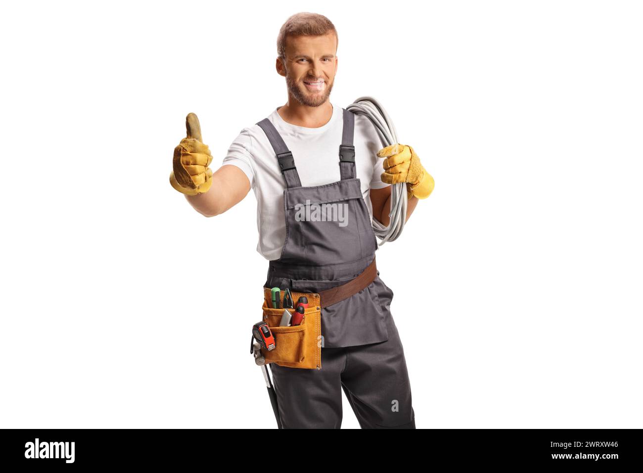 Electrician in a uniform carrying cables on his shoulder and gesturing ...
