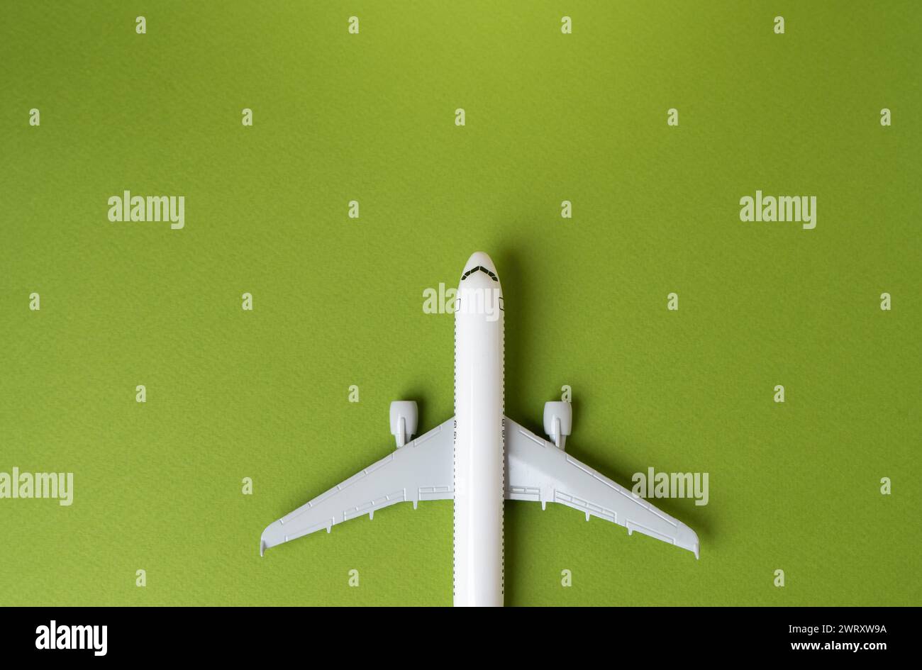Airline plane top view on green background. Business and tourism ...