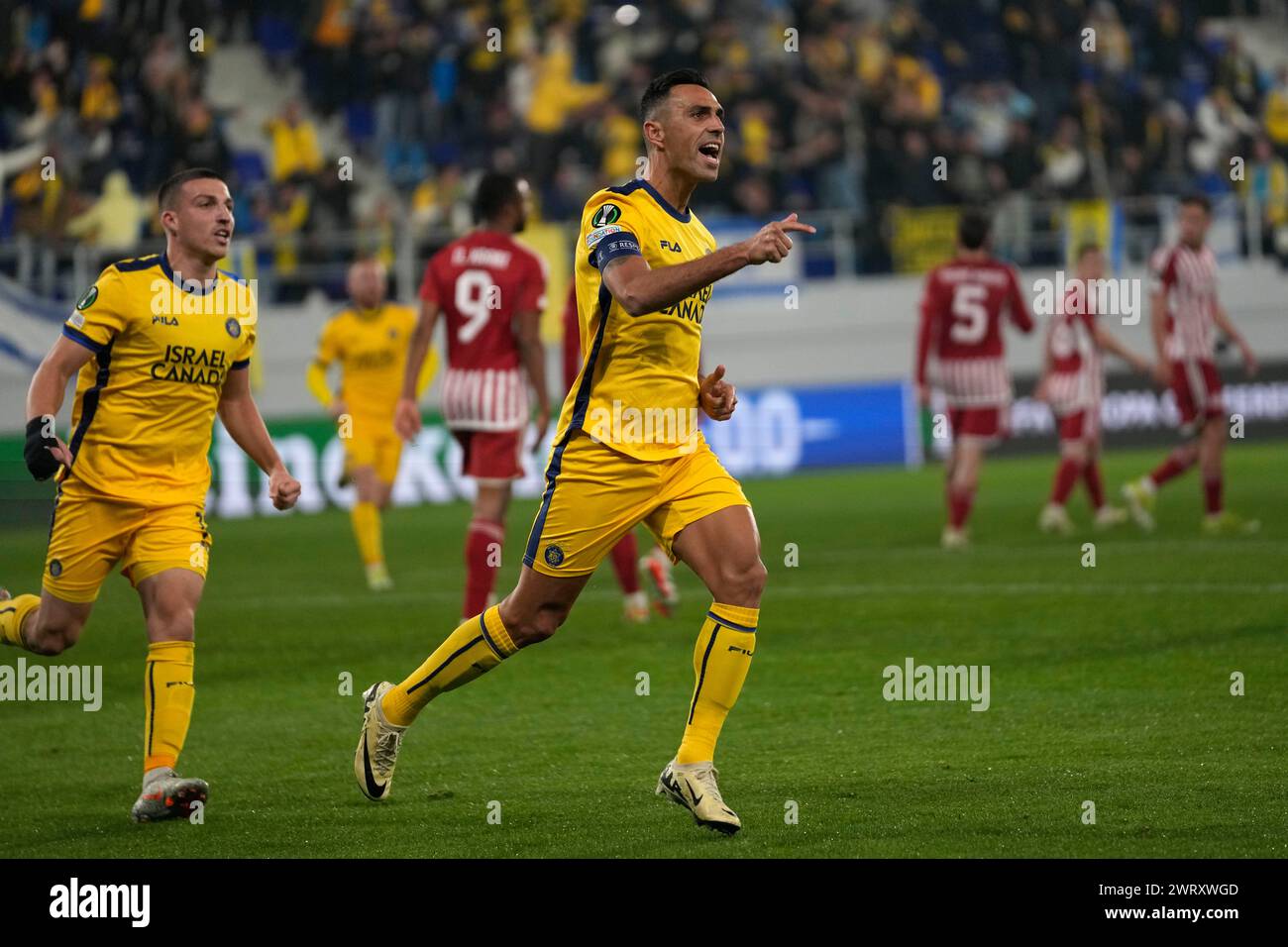 Maccabi Tel Aviv's Eran Zahavi scores his side's first goal during the ...
