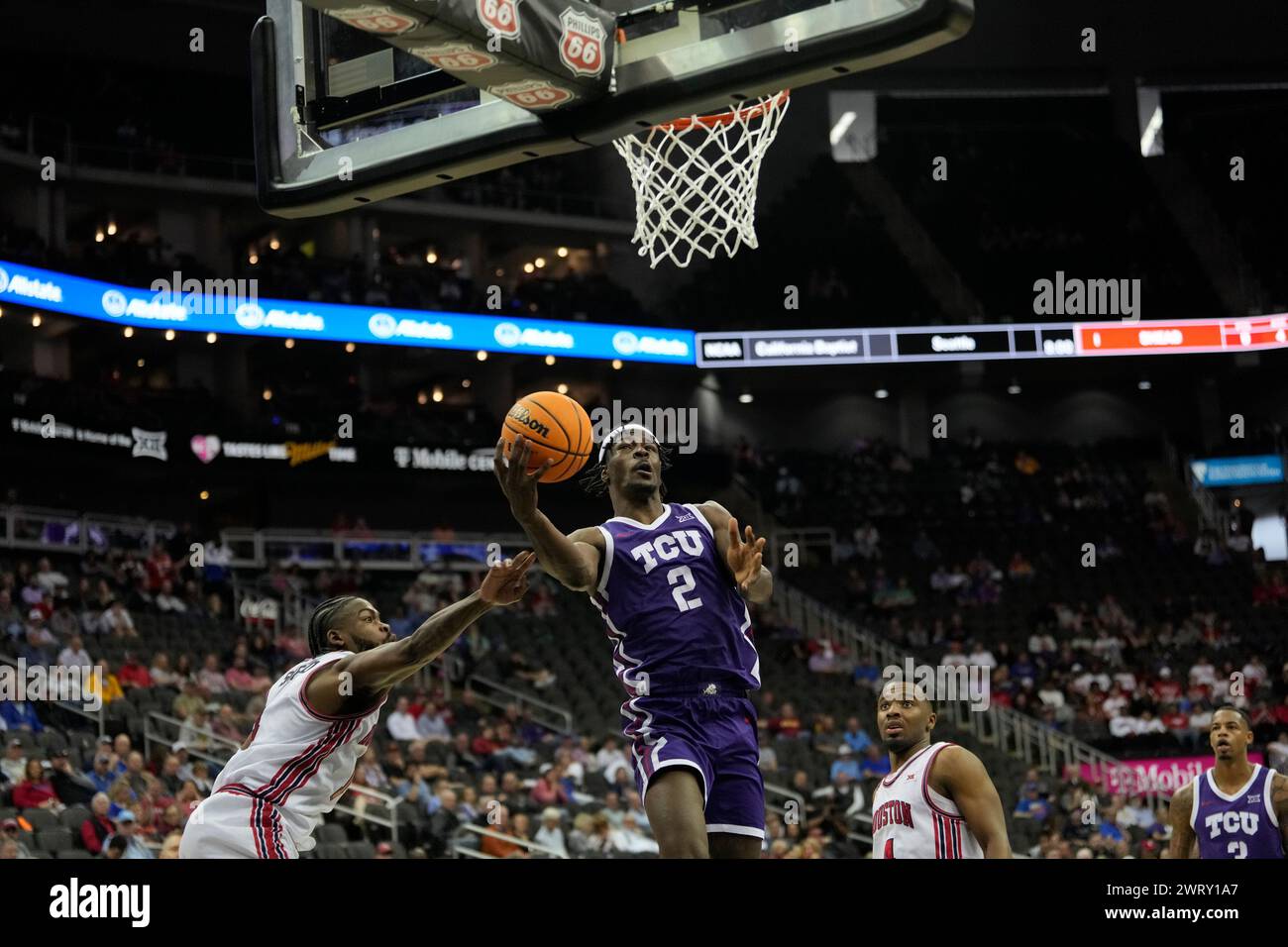 MAR 14 2024: TCU Horned Frogs forward Emanuel Miller (2) drives to the ...