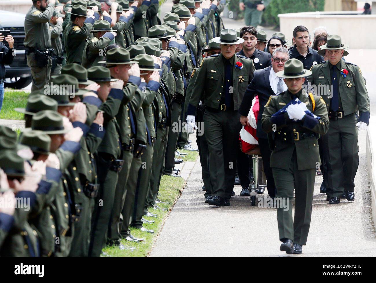 The flag draped casket of U.S. Border Patrol Christopher Luna is led to ...