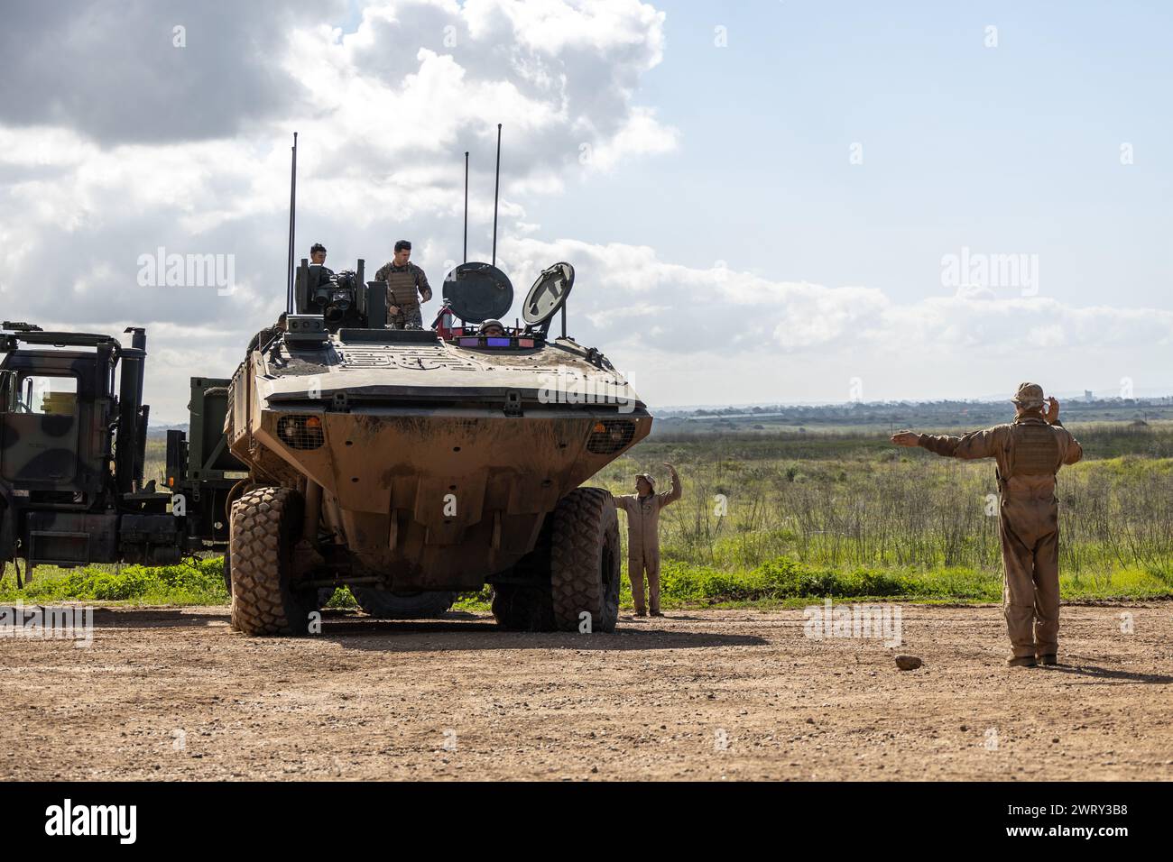 U.S. Marines with Assault Amphibian School, ground guide an Amphibious ...