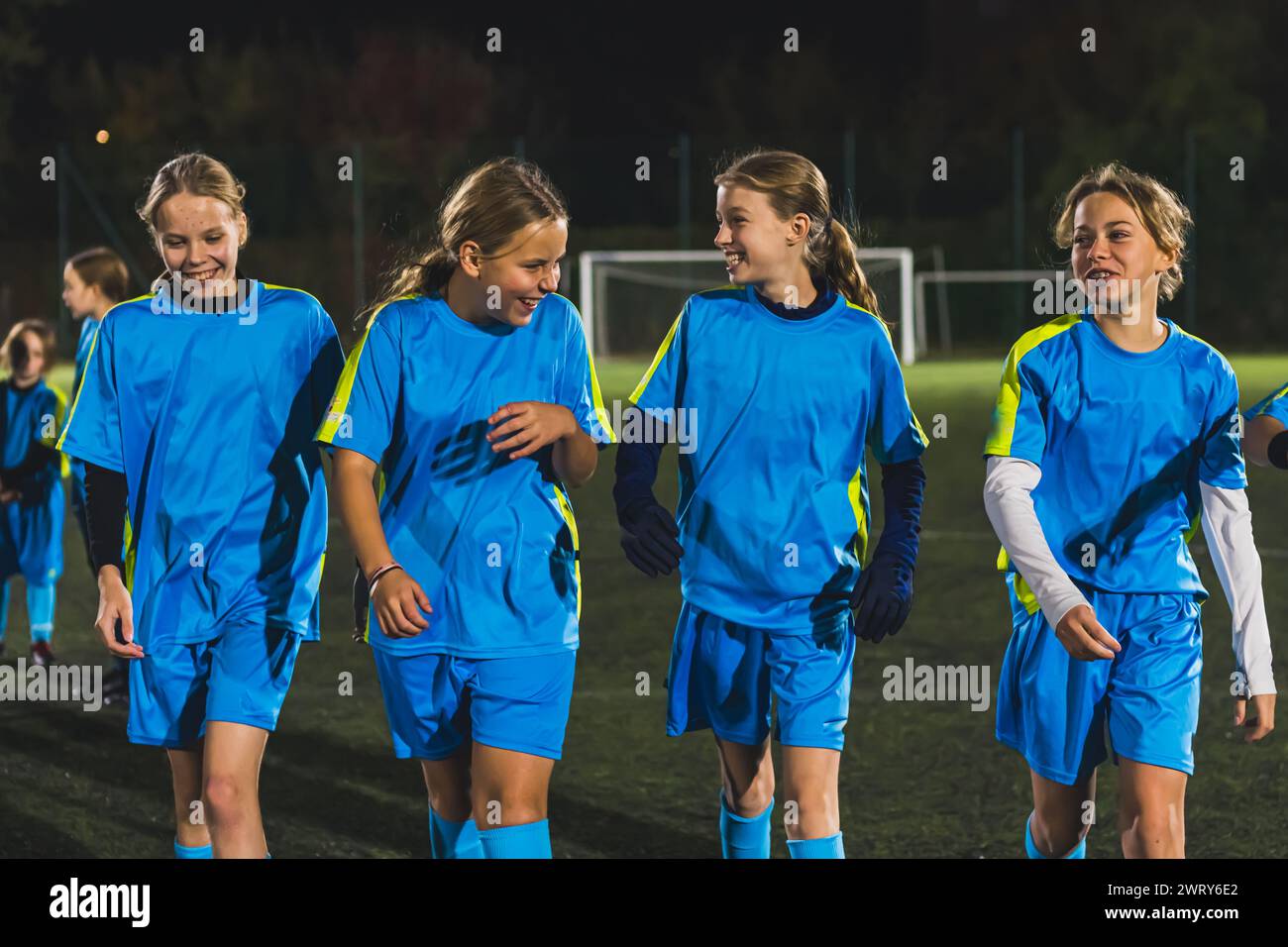 Girls in sports soccer team outdoors. Female physical education class ...