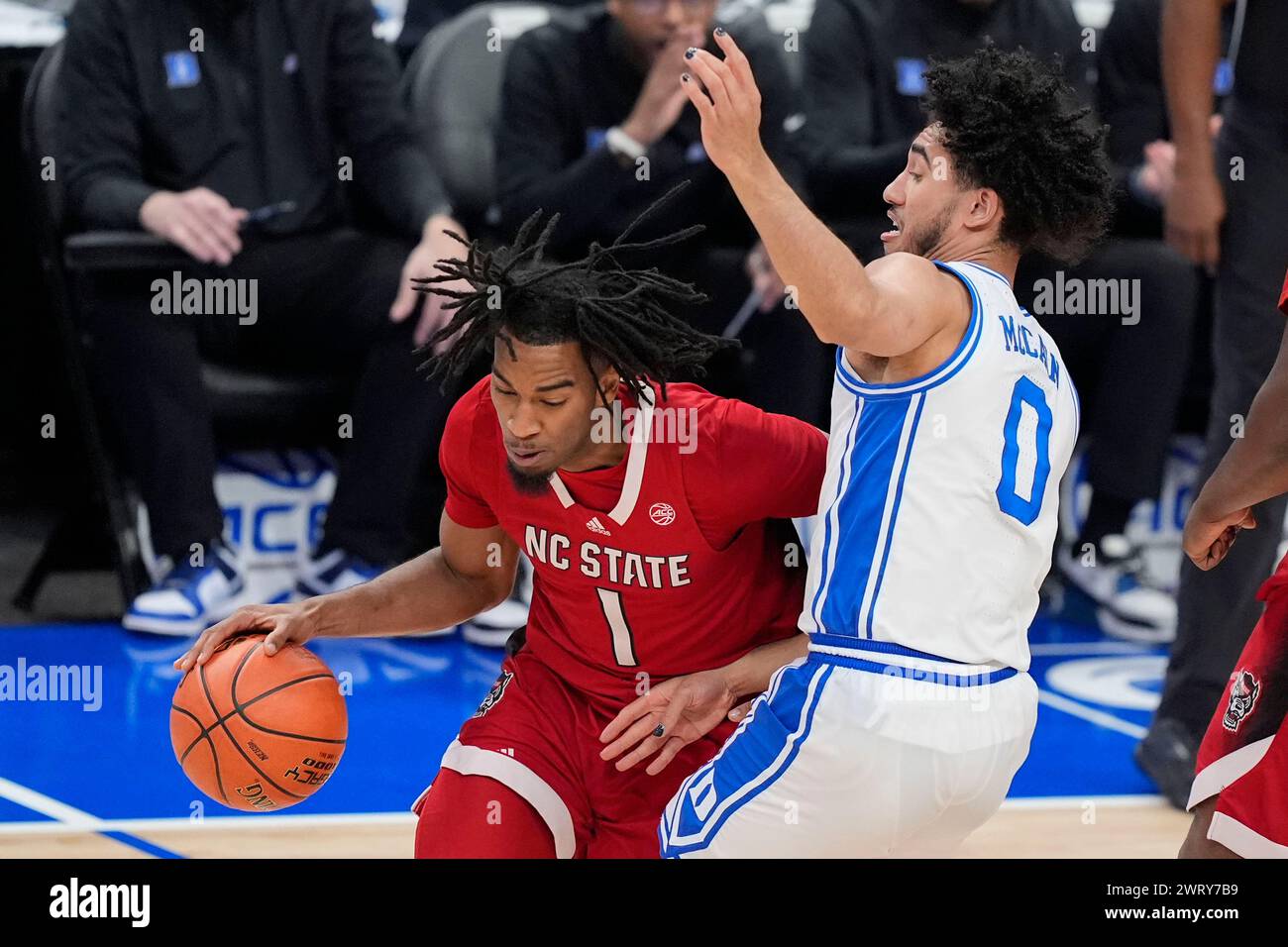 North Carolina State guard Jayden Taylor (1) collides with Duke guard ...