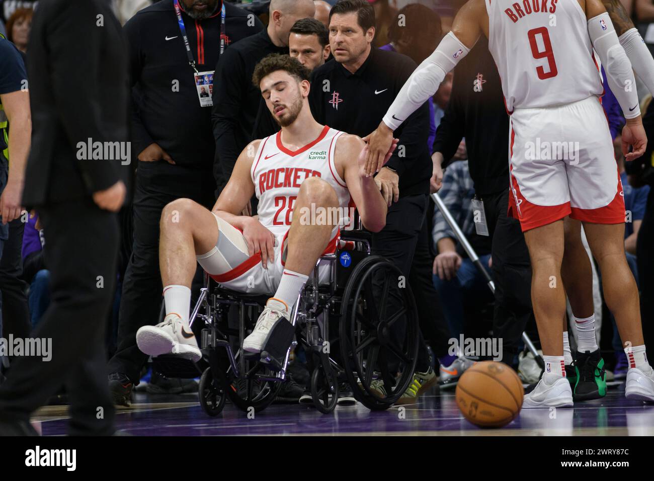 Houston Rockets center Alperen Sengun is wheeled from the arena in a ...