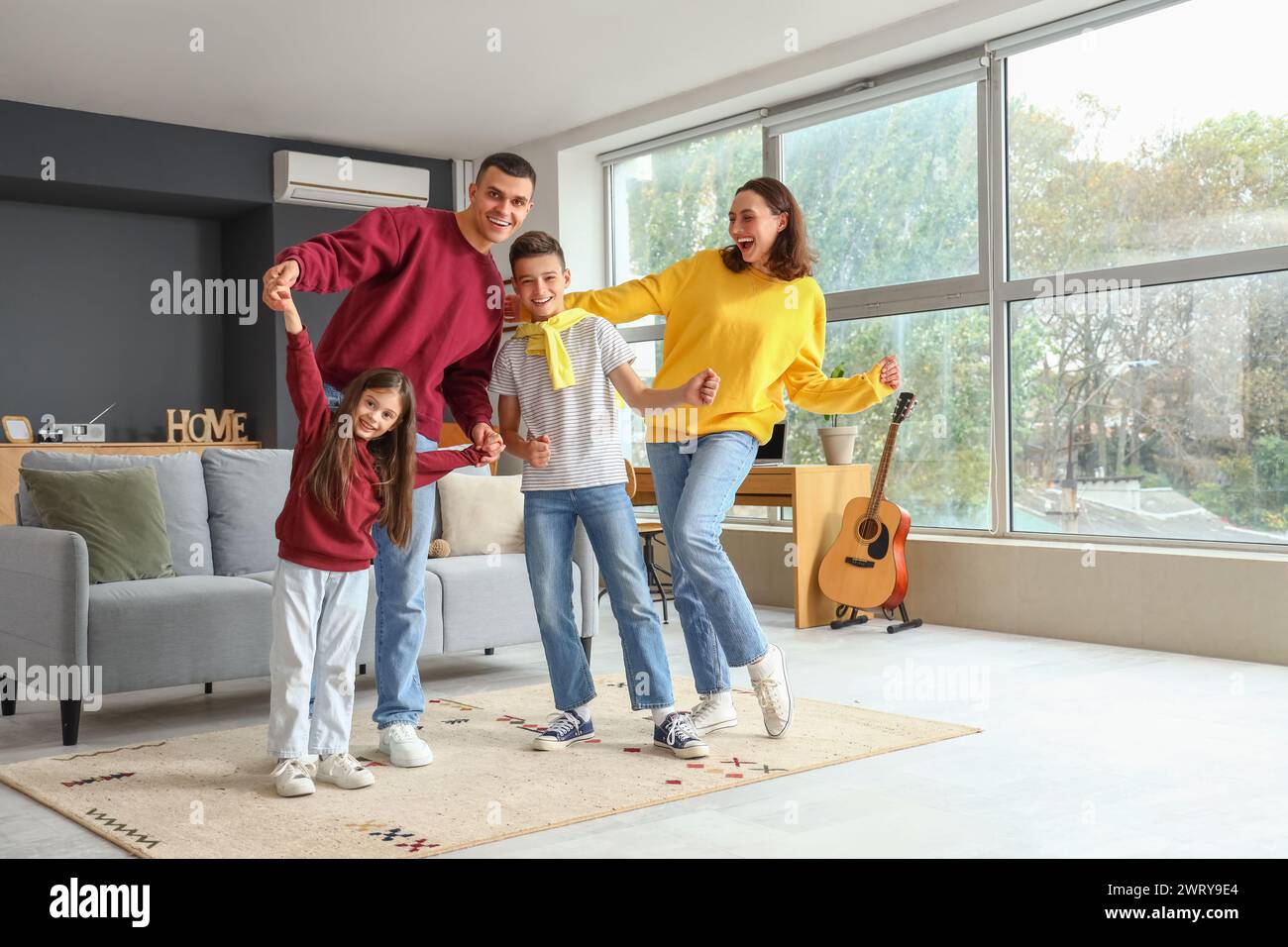 Little children with their parents dancing at home Stock Photo - Alamy