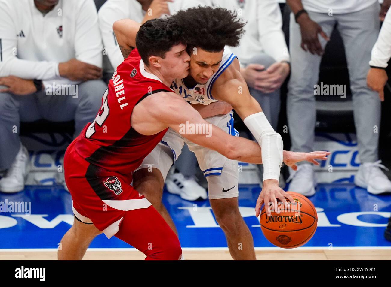 North Carolina State guard Michael O'Connell (12) fouls Duke guard ...