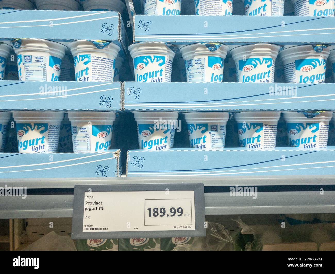 Picture of a pellet of blue yogurt pots ready to be sold from a dairy ...