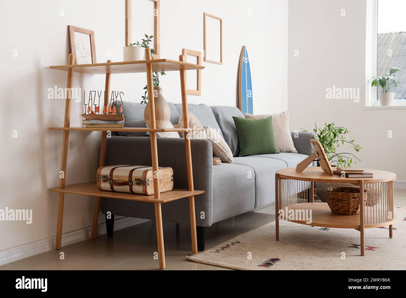 Modern comfortable interior of living room with soft sofa and table ...