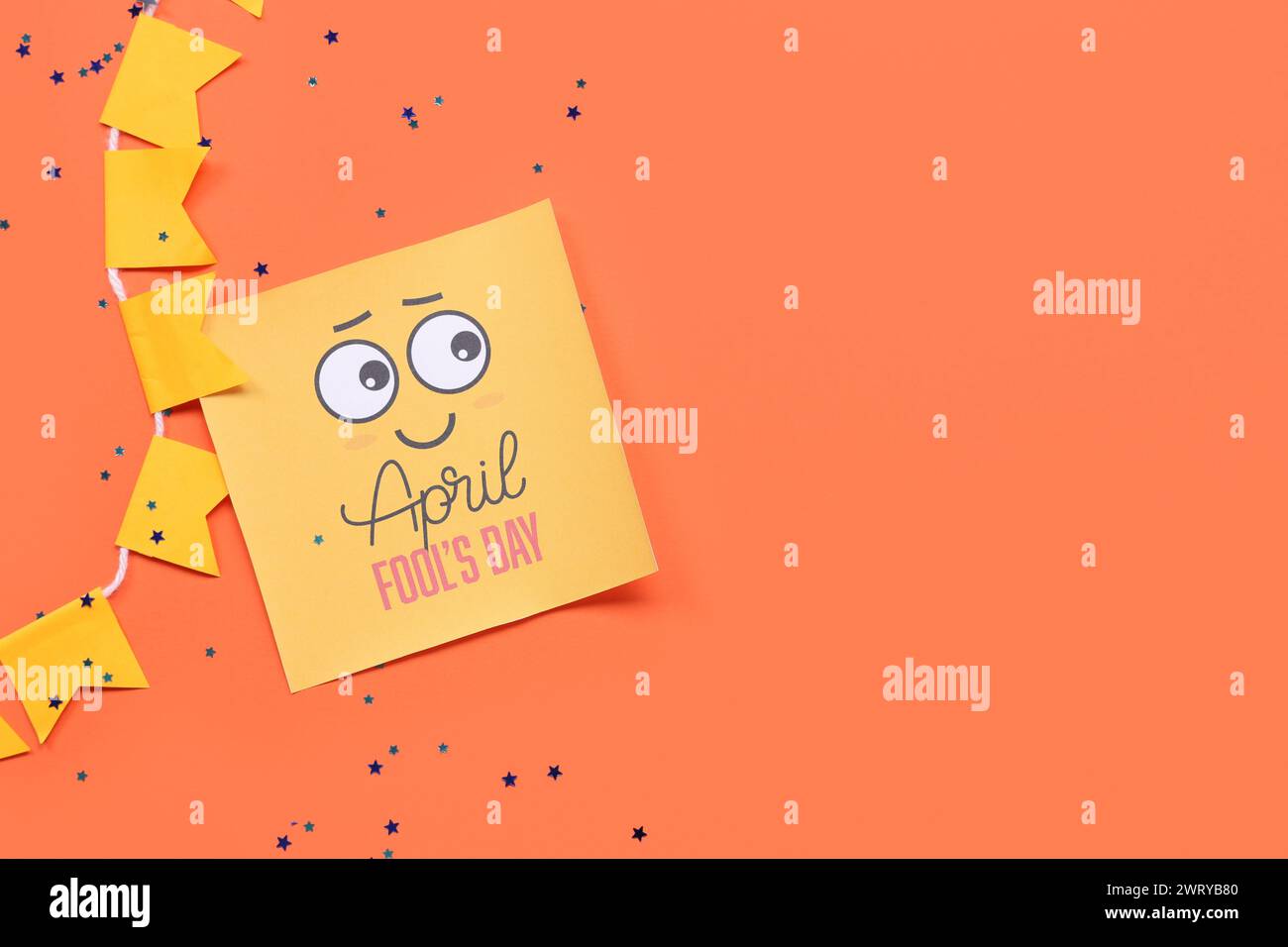 Festive postcard for April Fools Day with paper garland and sequins on ...