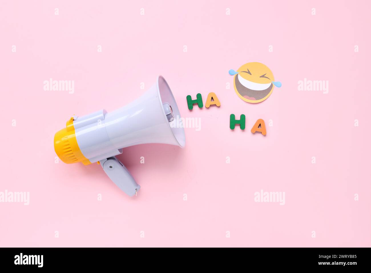 Megaphone with text HA HA on pink background. April Fools Day ...