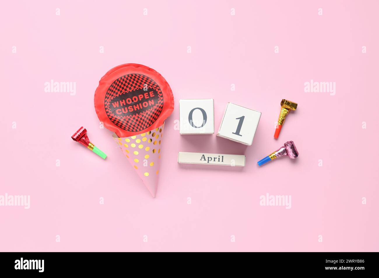 Calendar with whoopee cushion, party hat and whistles on pink ...