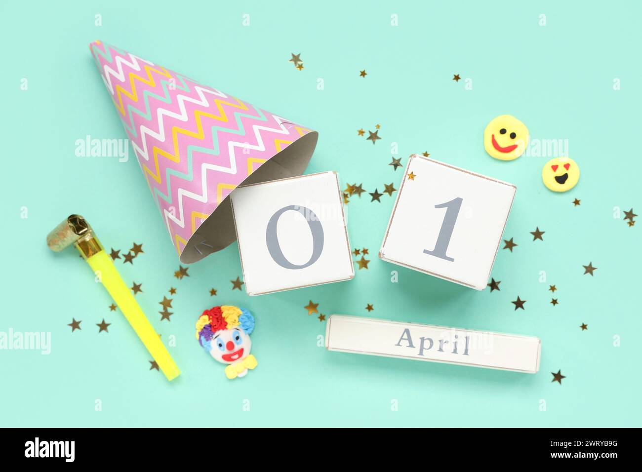 Calendar with party decor on turquoise background. April Fools Day ...