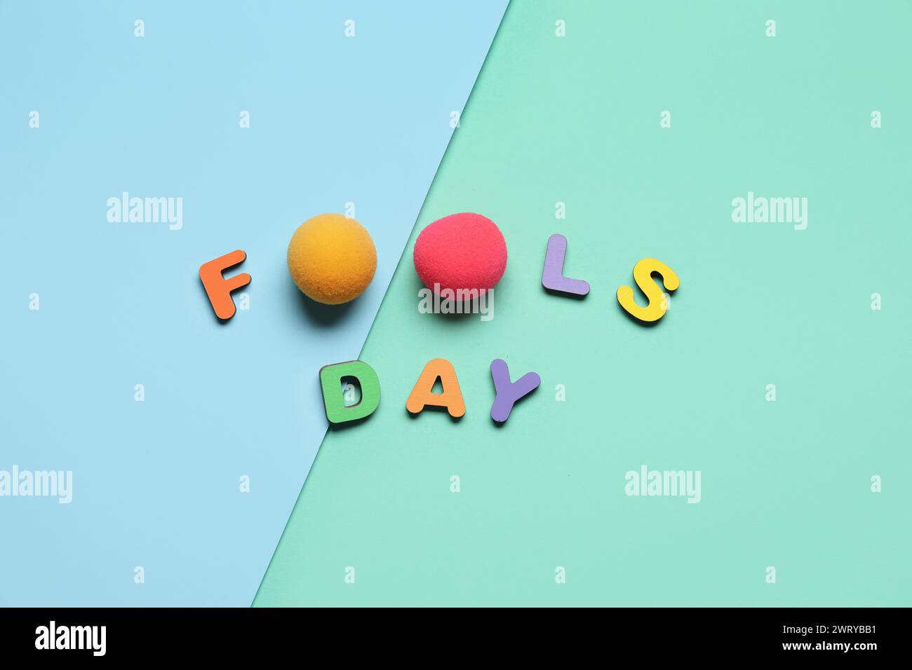 Test FOOLS DAY with clown noses on color background Stock Photo - Alamy