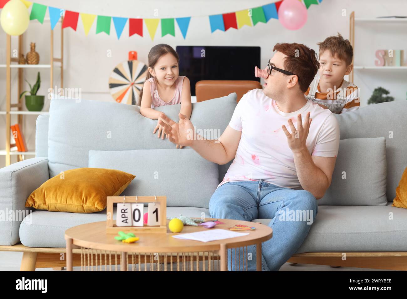 Little children pranked their father with funny disguise at home. April ...