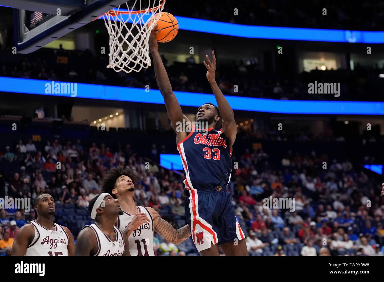 Mississippi forward Moussa Cisse (33) scores as Texas A&M's Andersson ...