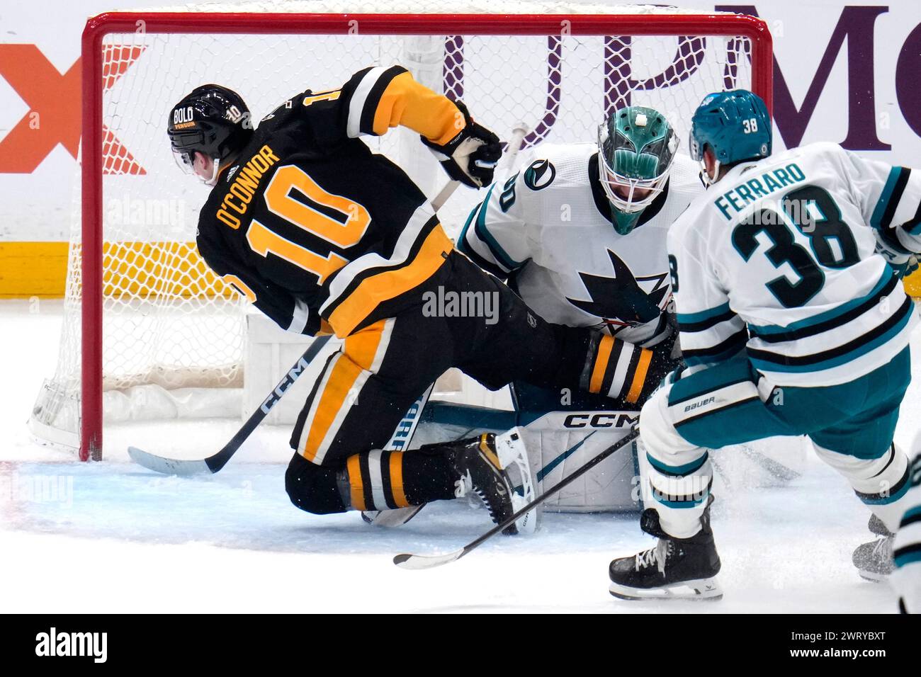 Pittsburgh Penguins' Drew O'Connor (10) collides with San Jose Sharks ...