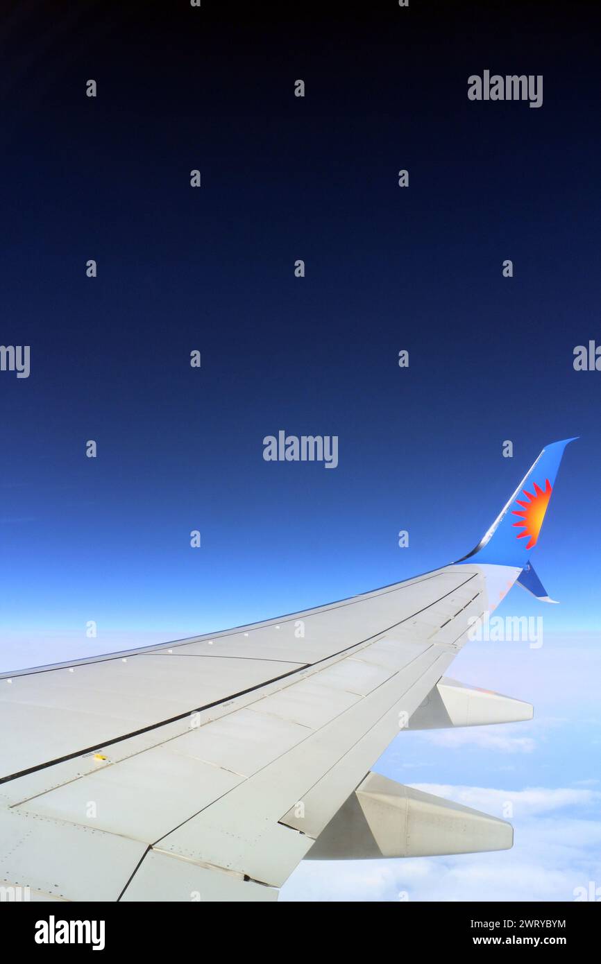 Starboard wing of a Jet2 Boeing 737-800 at 37000 feet above the North ...