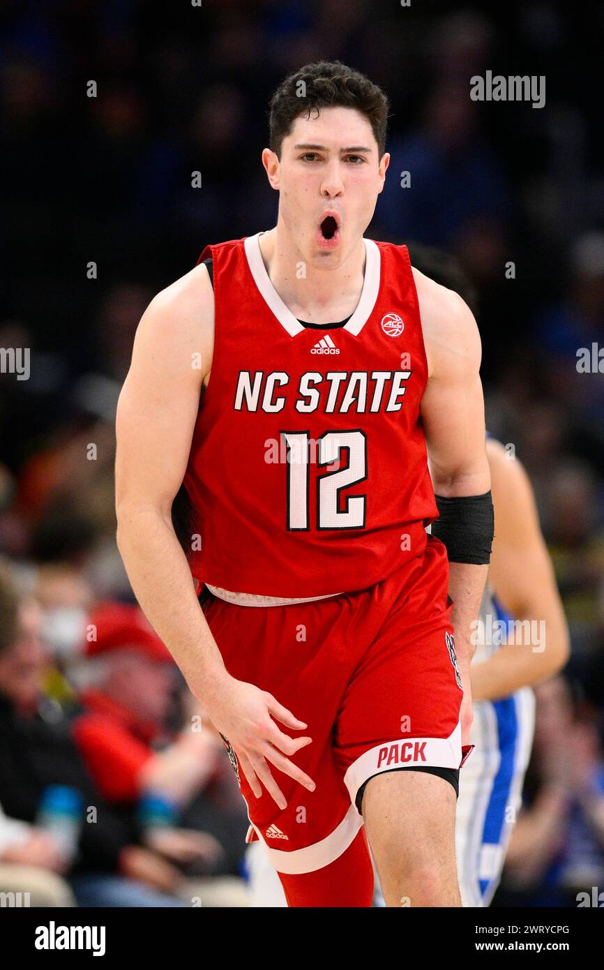 North Carolina State guard Michael O'Connell (12) reacts after hitting ...