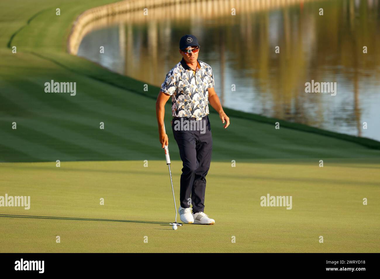 PONTE VEDRA BEACH, FL - MARCH 14: PGA golfer Rickie Fowler putts on the 18th hole during The ...