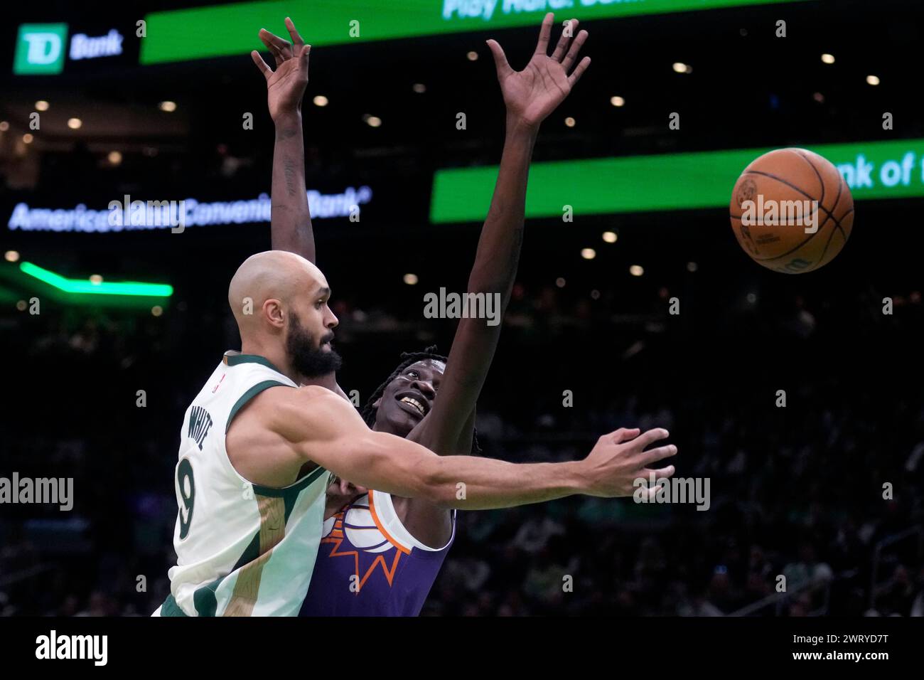 Boston Celtics guard Derrick White (9) passes the ball while pressured ...