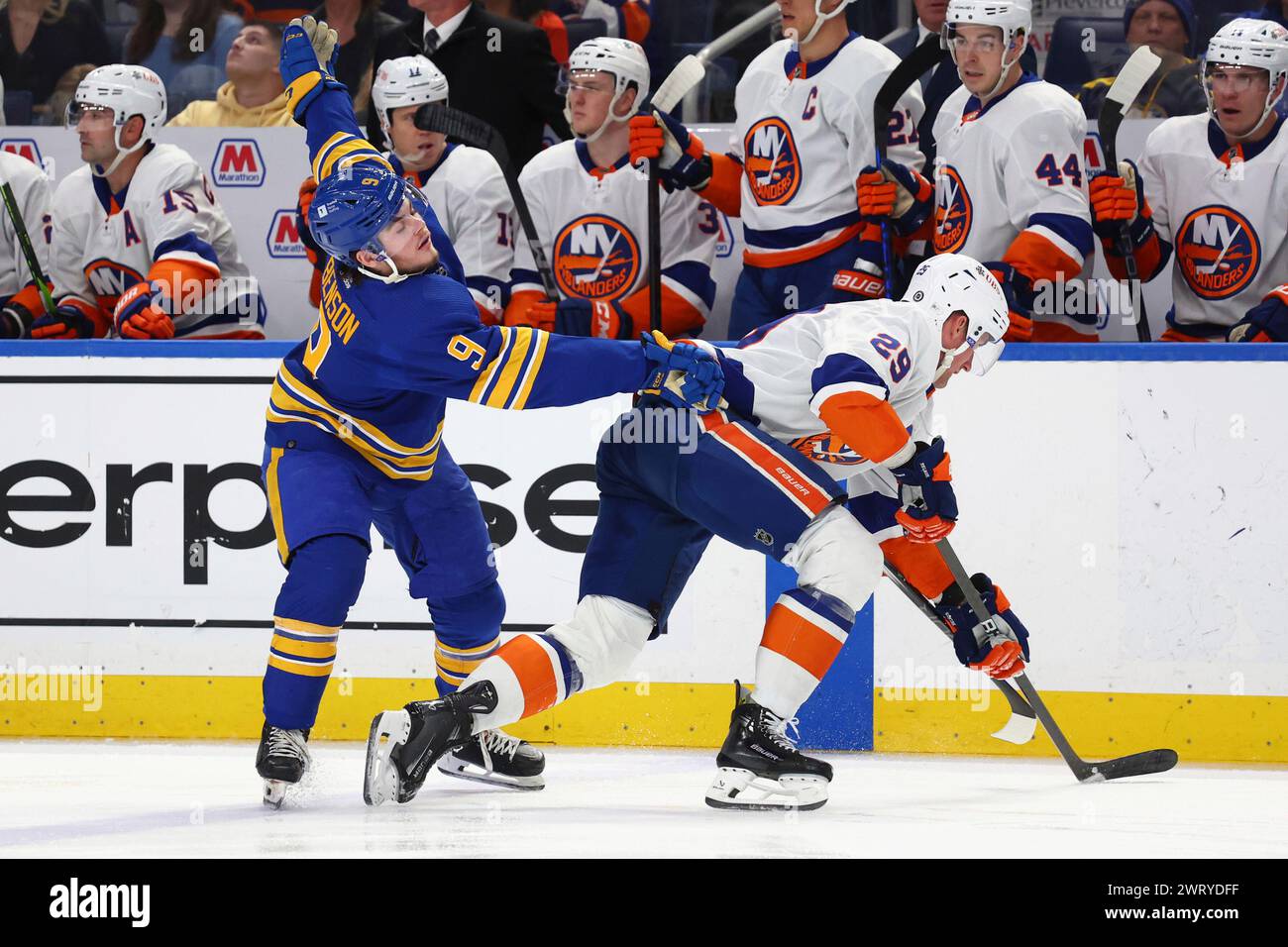 Buffalo Sabres left wing Zach Benson (9) and New York Islanders center ...