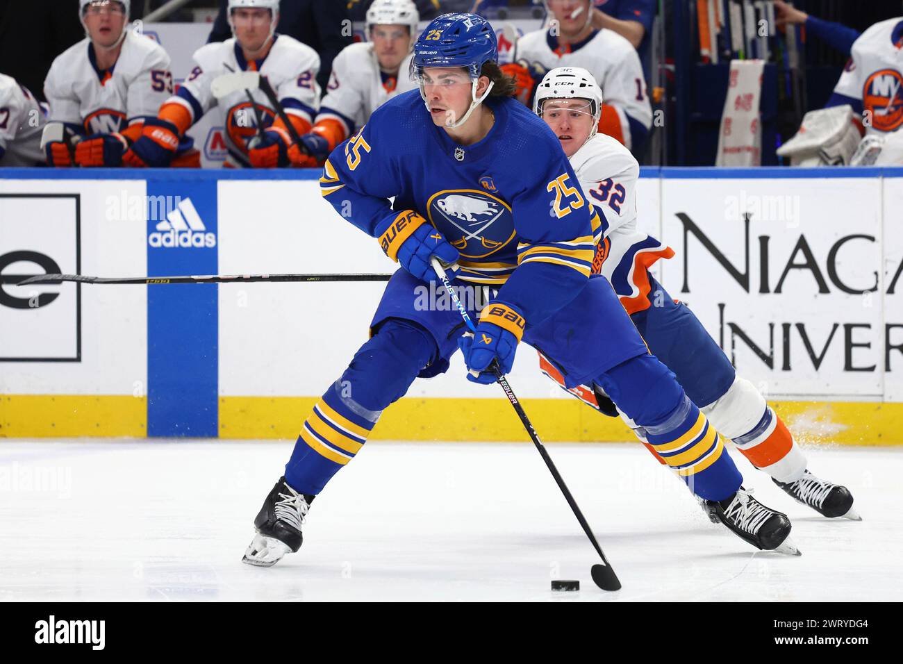 Buffalo Sabres defenseman Owen Power (25) is chased by New York ...