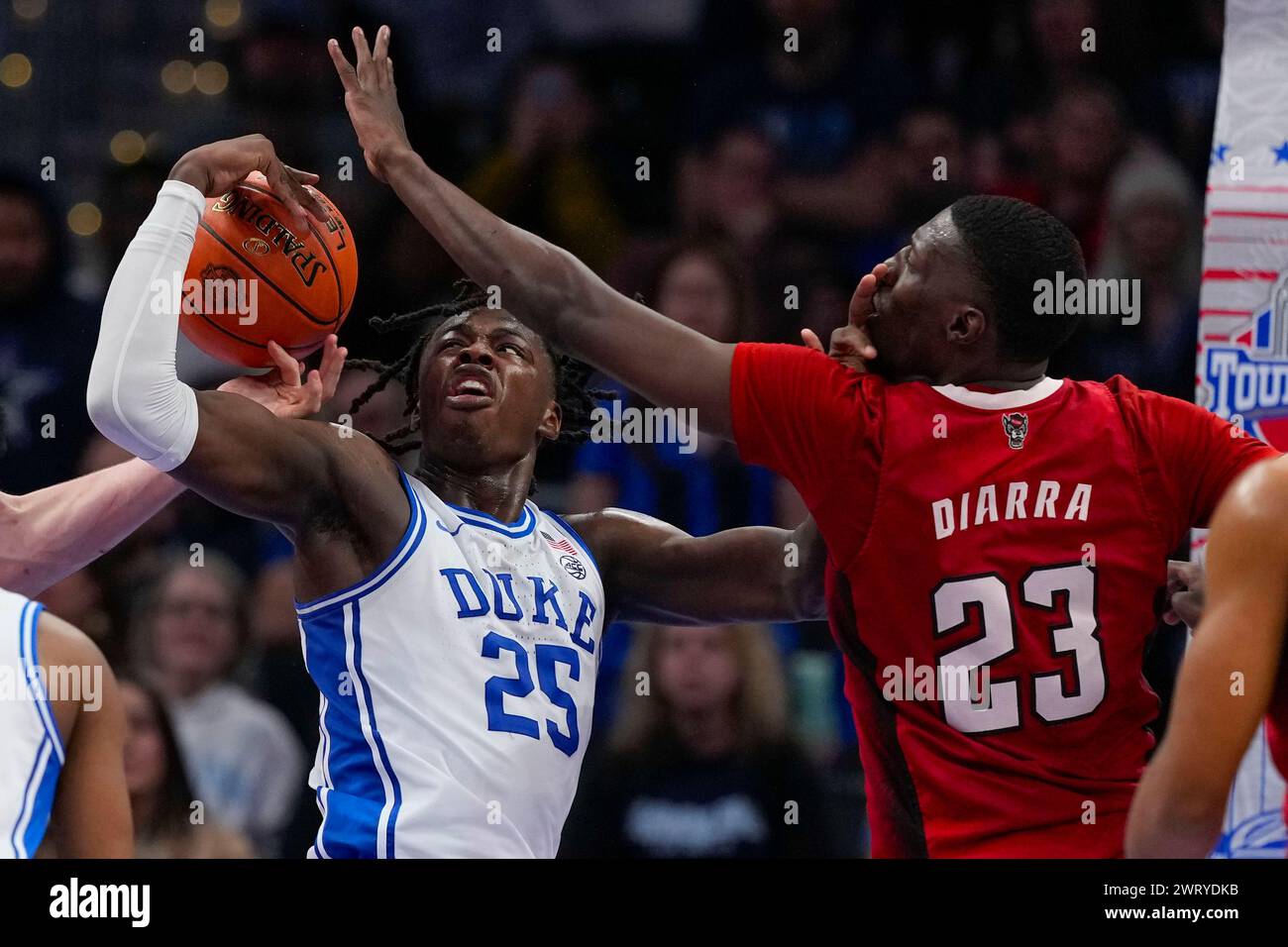 Duke forward Mark Mitchell (25) loose control of the ball while going ...