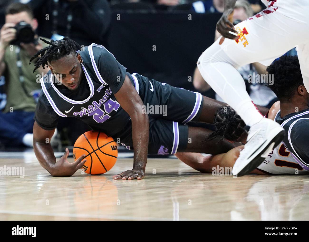 MAR 14 2024: Kansas State Wildcats forward Arthur Kaluma (24) secures a ...