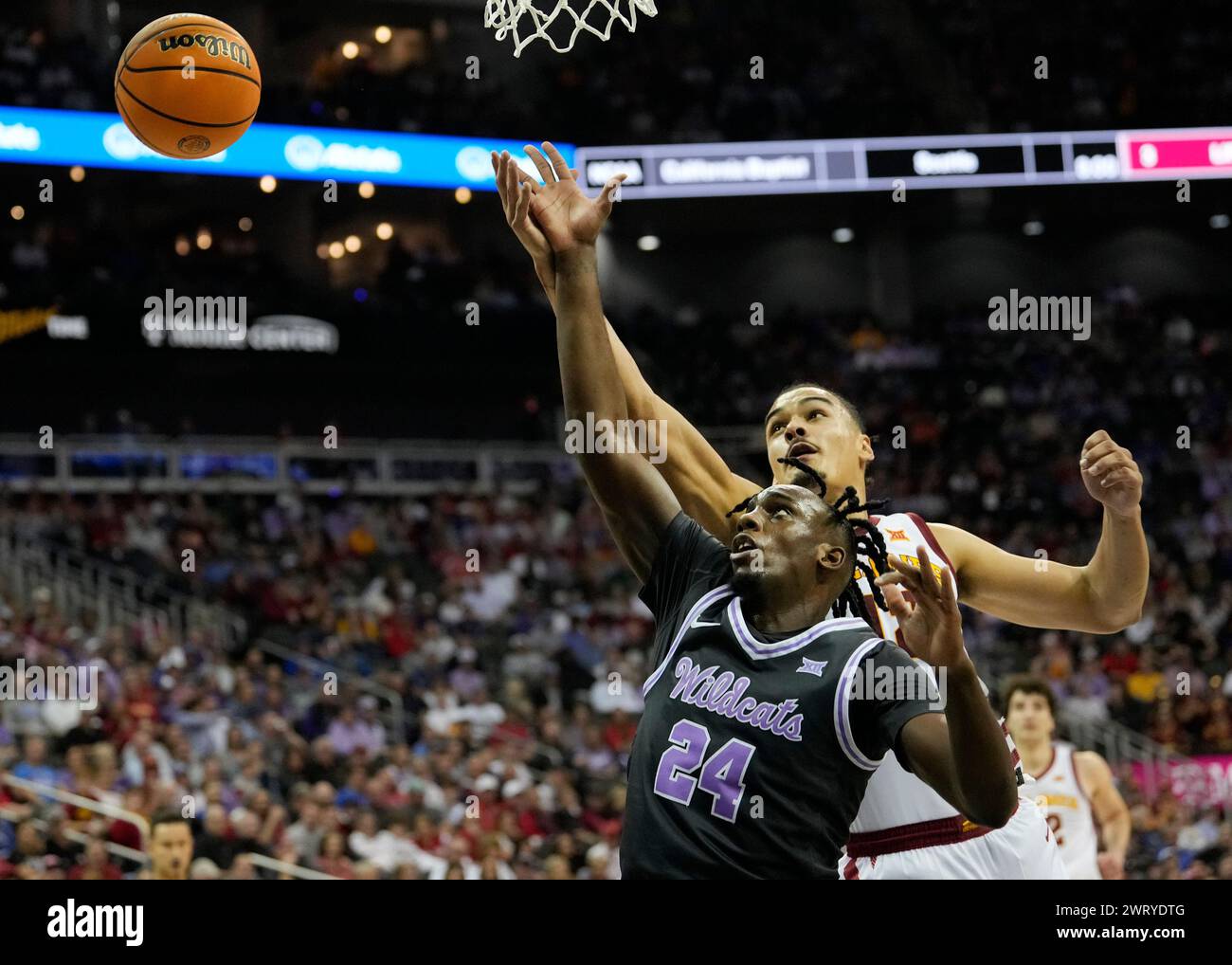 MAR 14 2024: Kansas State Wildcats forward Arthur Kaluma (24) and Iowa ...