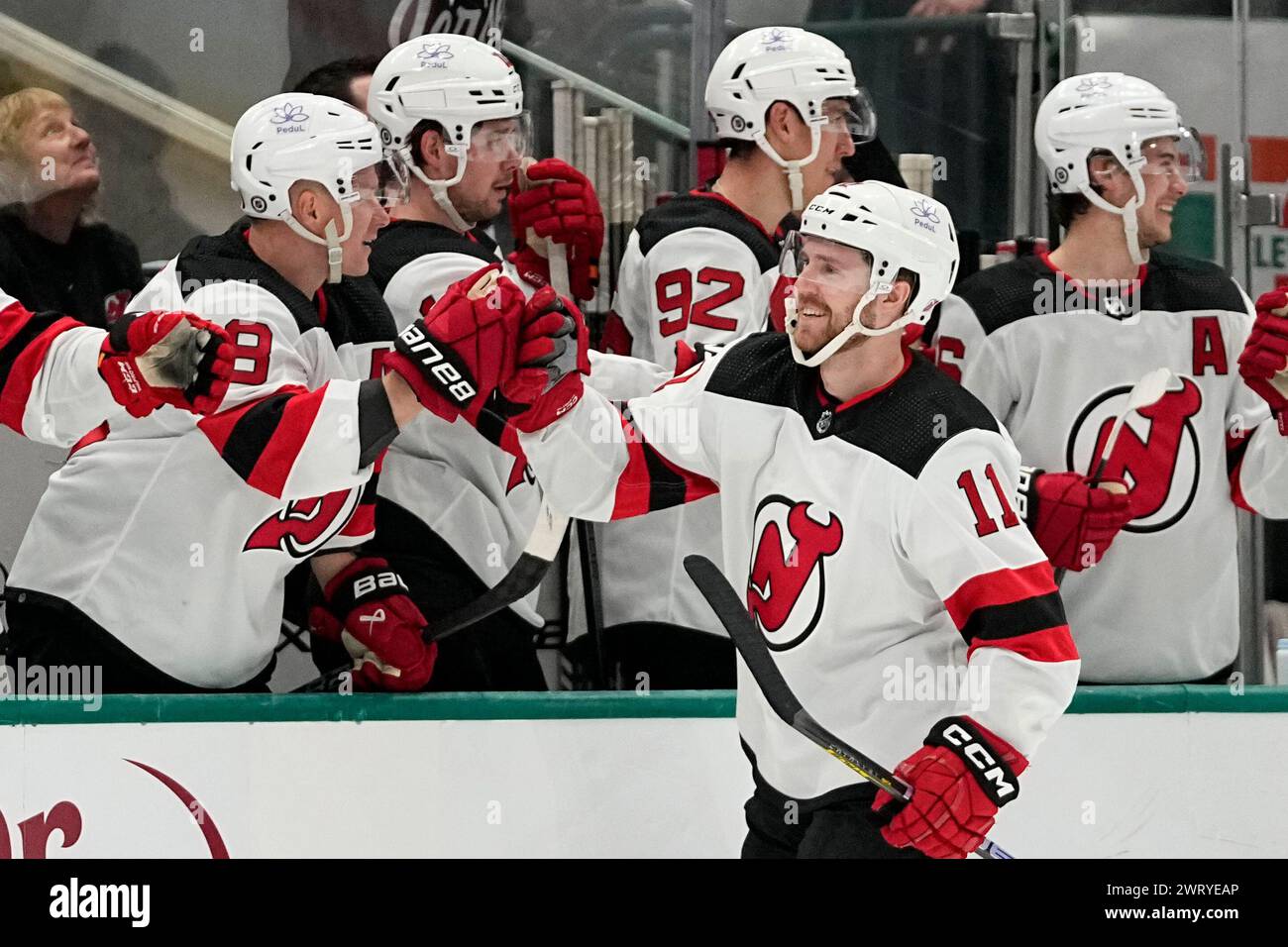 New Jersey Devils' Chris Tierney (11) celebrates with the bench after ...