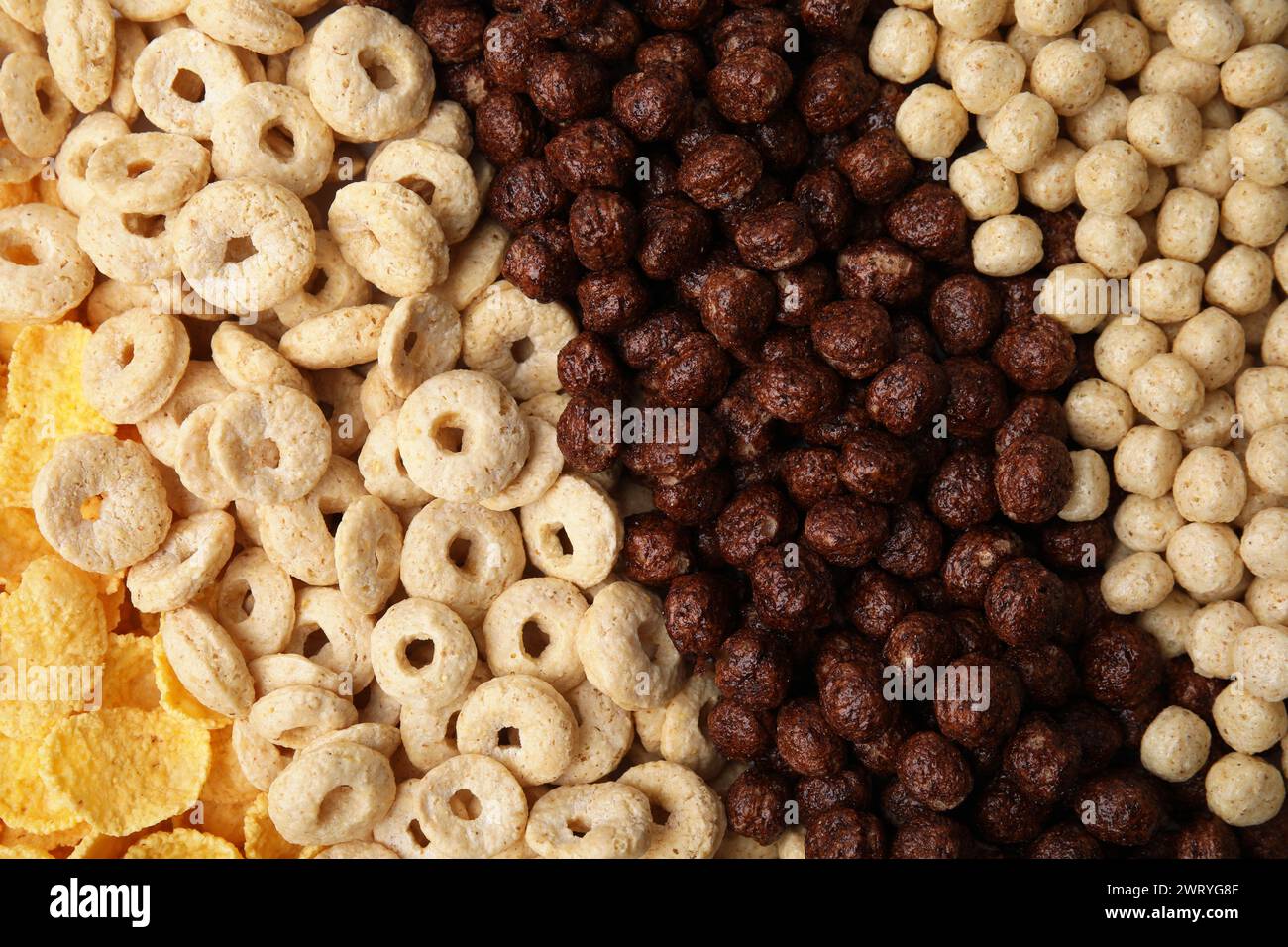 Different types of breakfast cereals as background, top view Stock ...