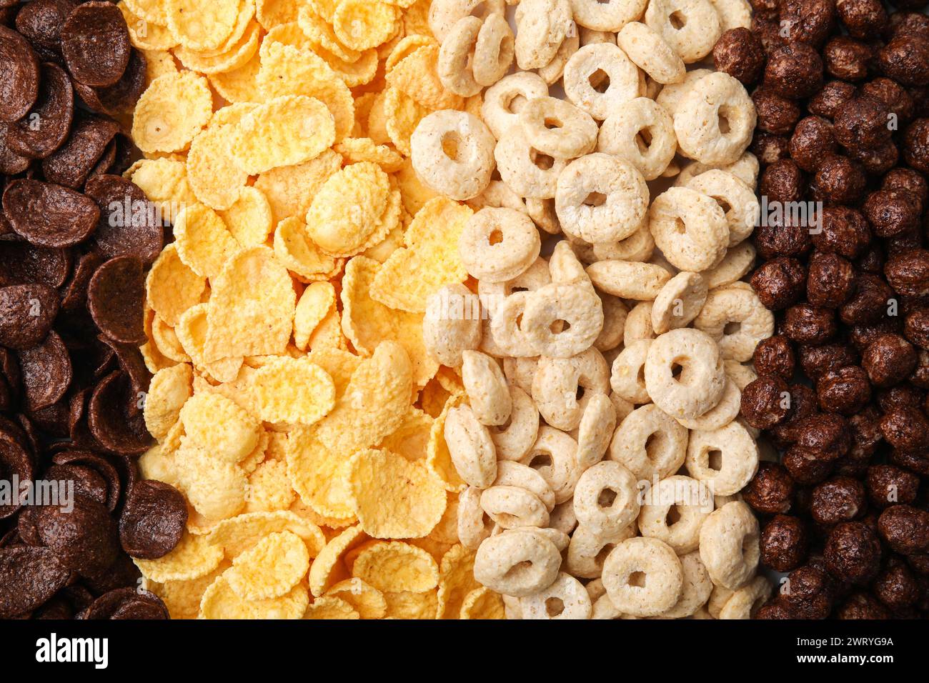 Different types of breakfast cereals as background, top view Stock ...