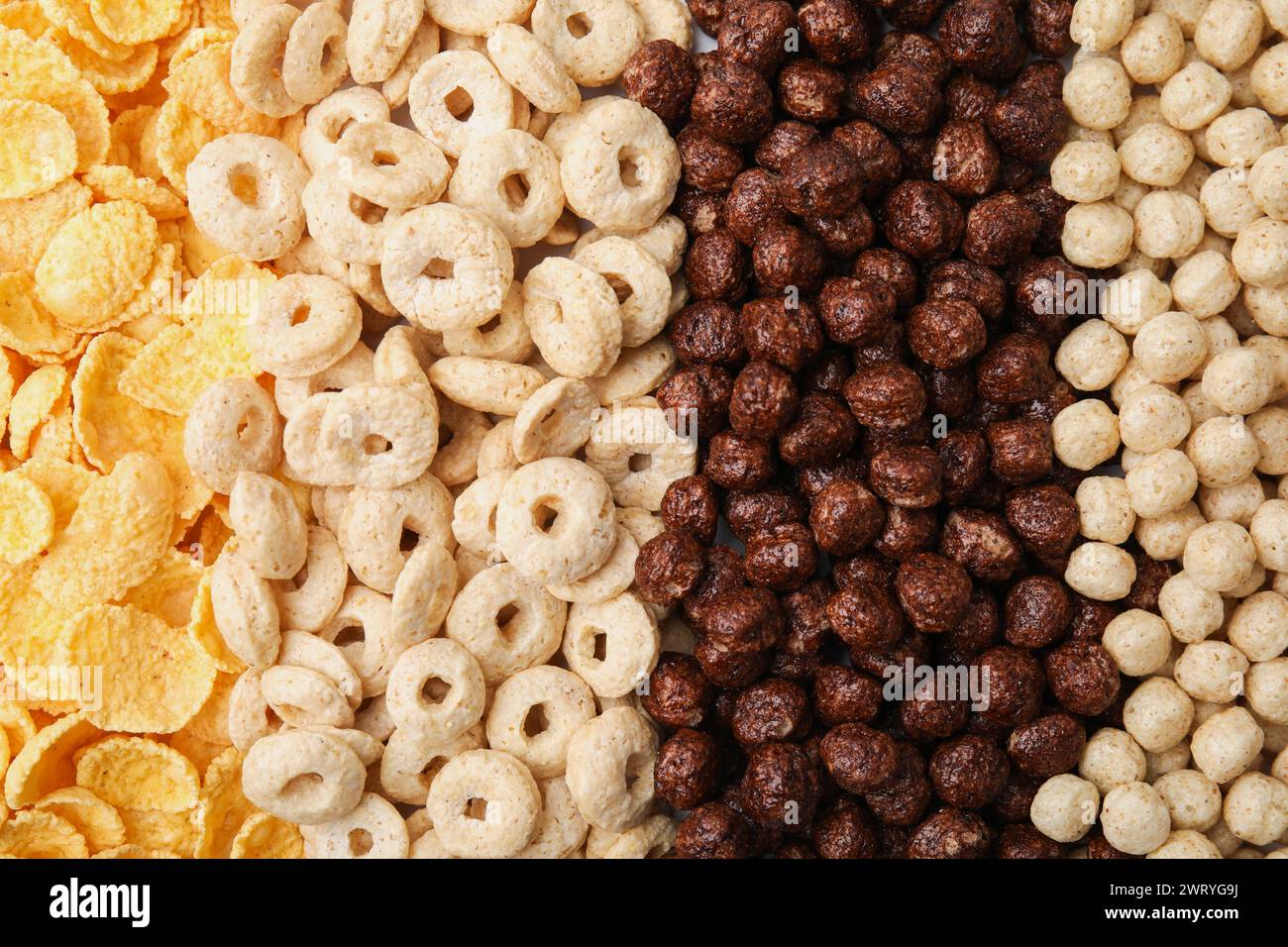Different types of breakfast cereals as background, top view Stock ...